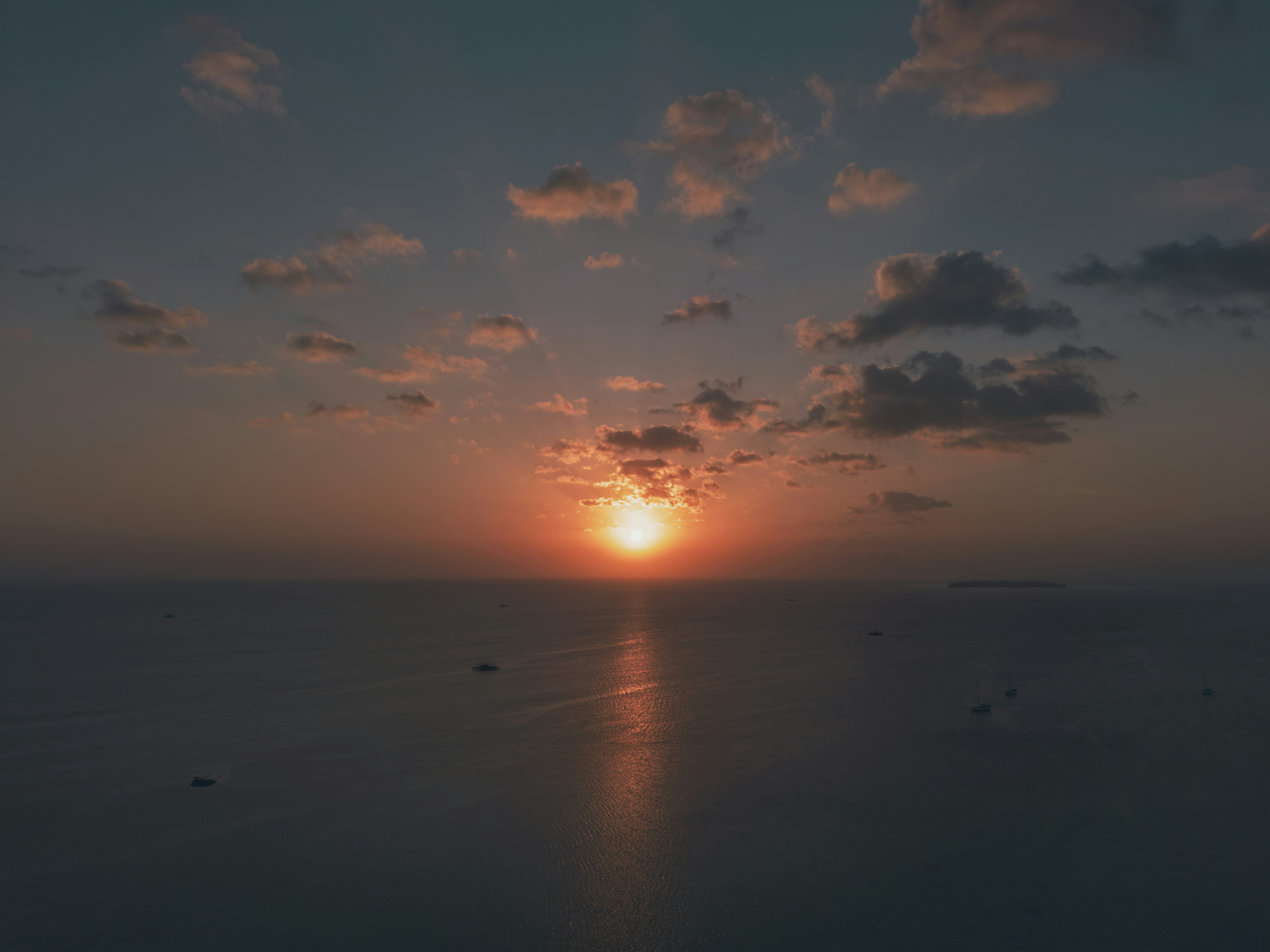 Dawn's Quiet Pulse: Sunset over a Glassy Sea
