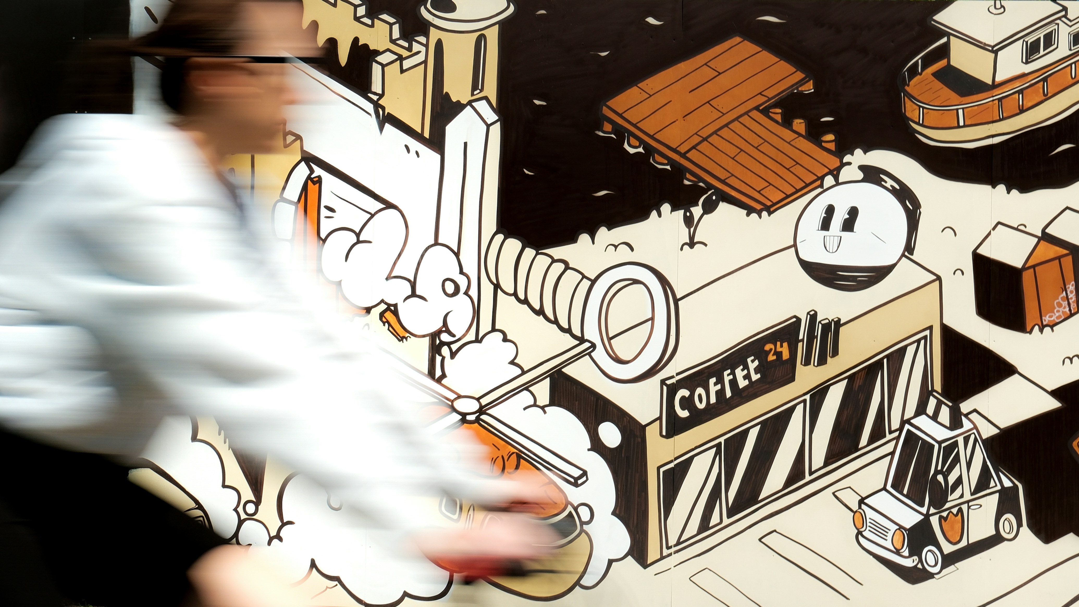 Motion in a Doodled City: Blurred Rider at the Café Corner