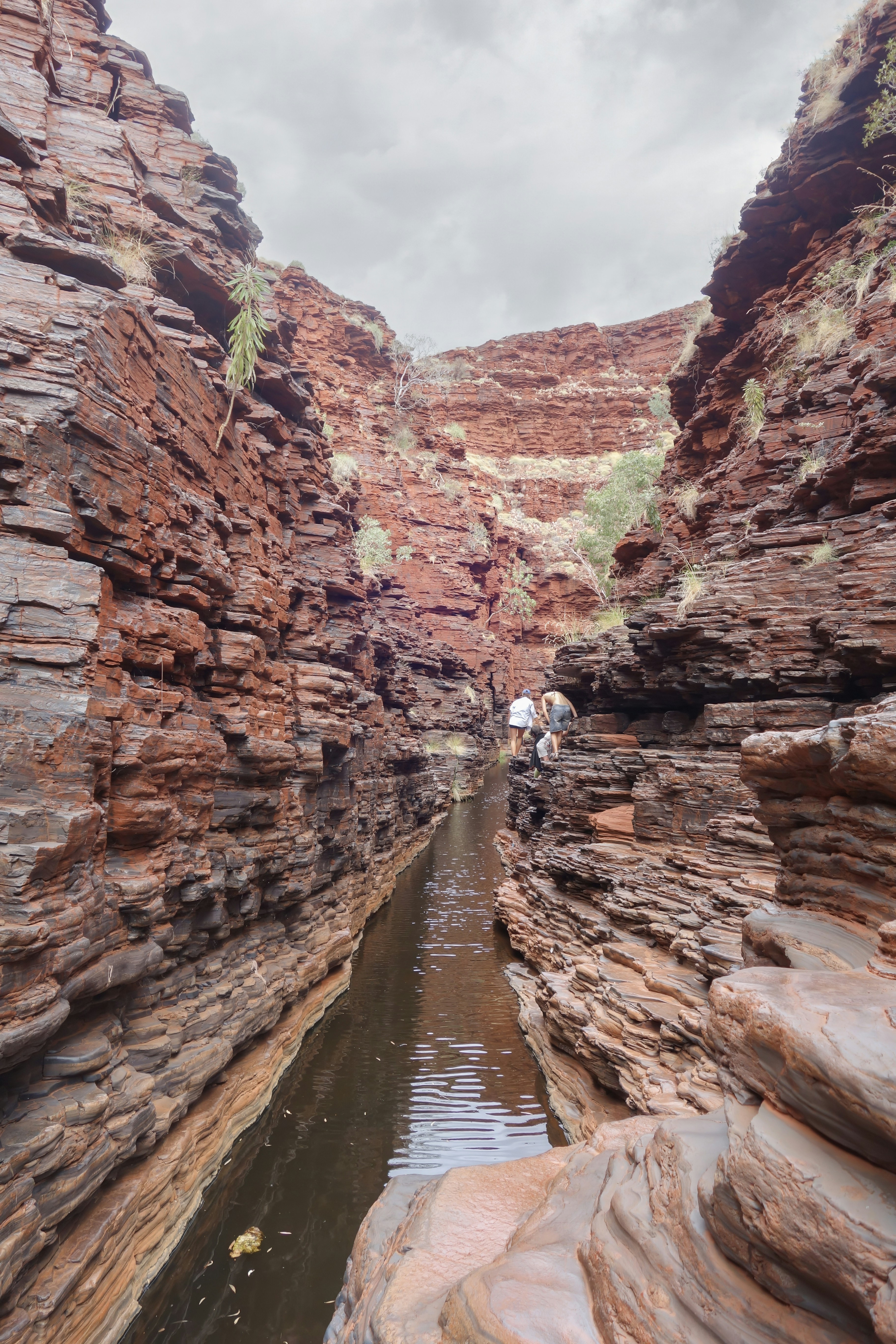 Chasm Run: Narrow Gorge Waterway Between Weathered Red Cliffs