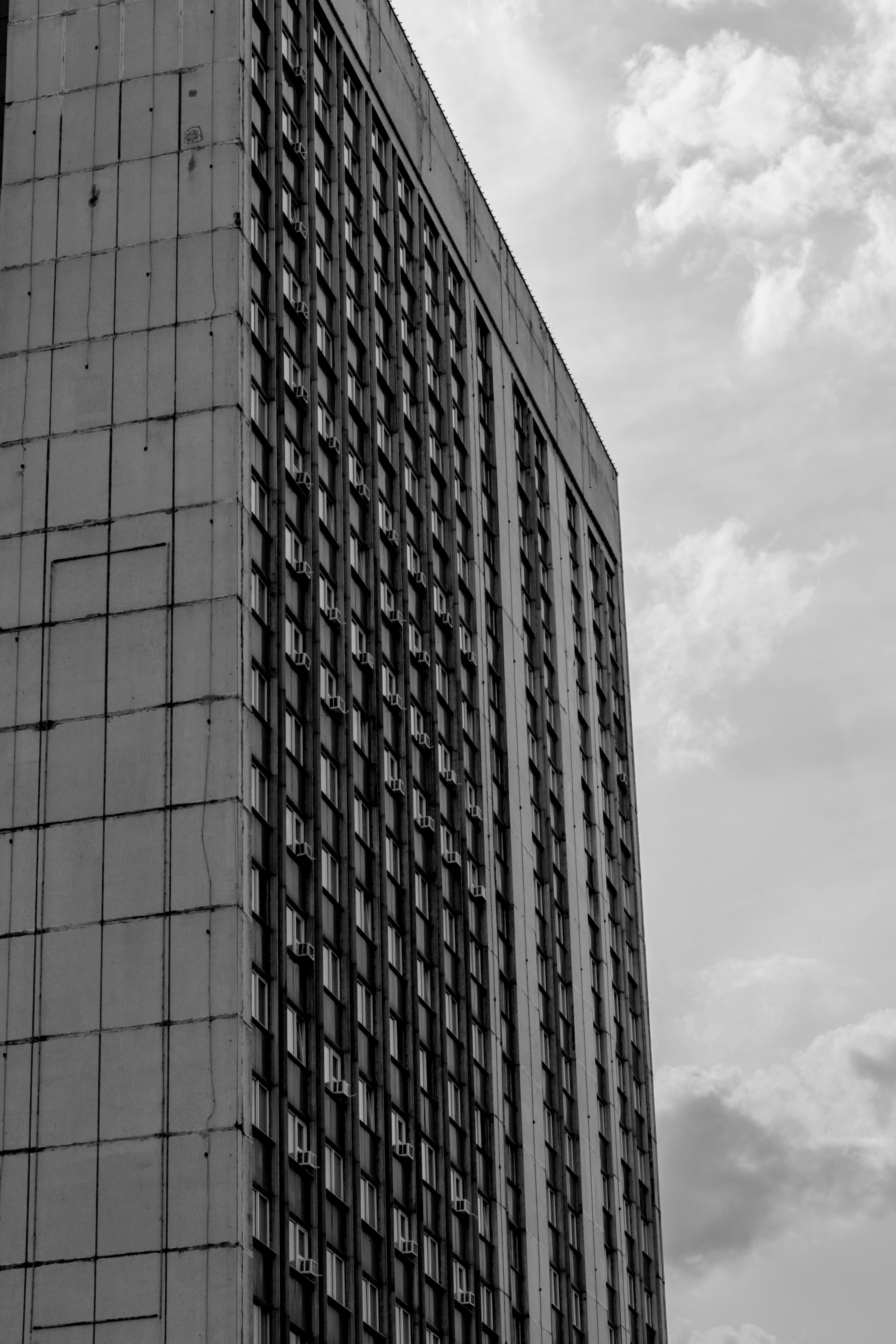 Concrete Skybound: A Monolithic Tower Reaches for the Clouds