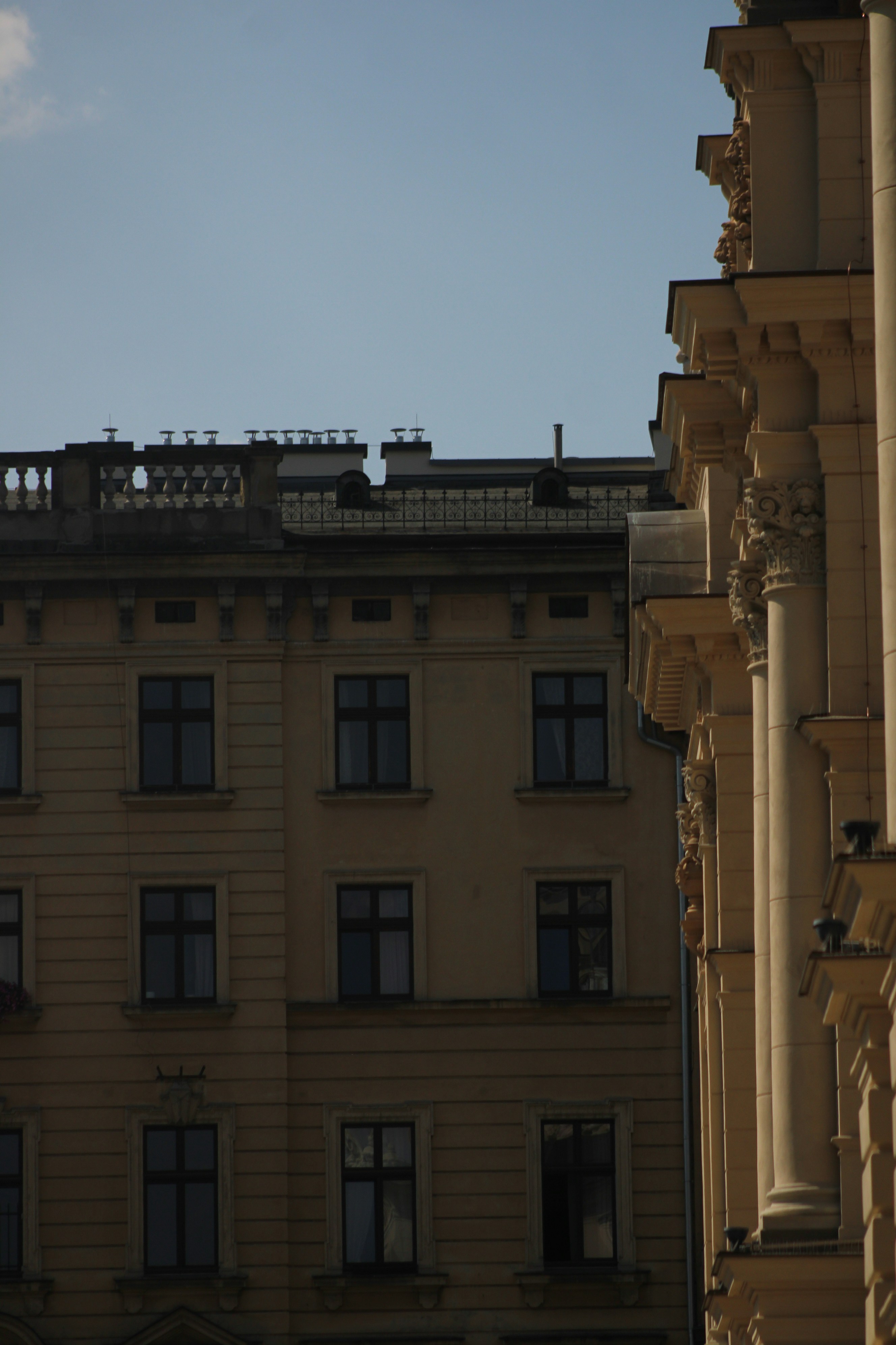 Sunlit Facade: Classic Architecture Framed by Evening Shadows