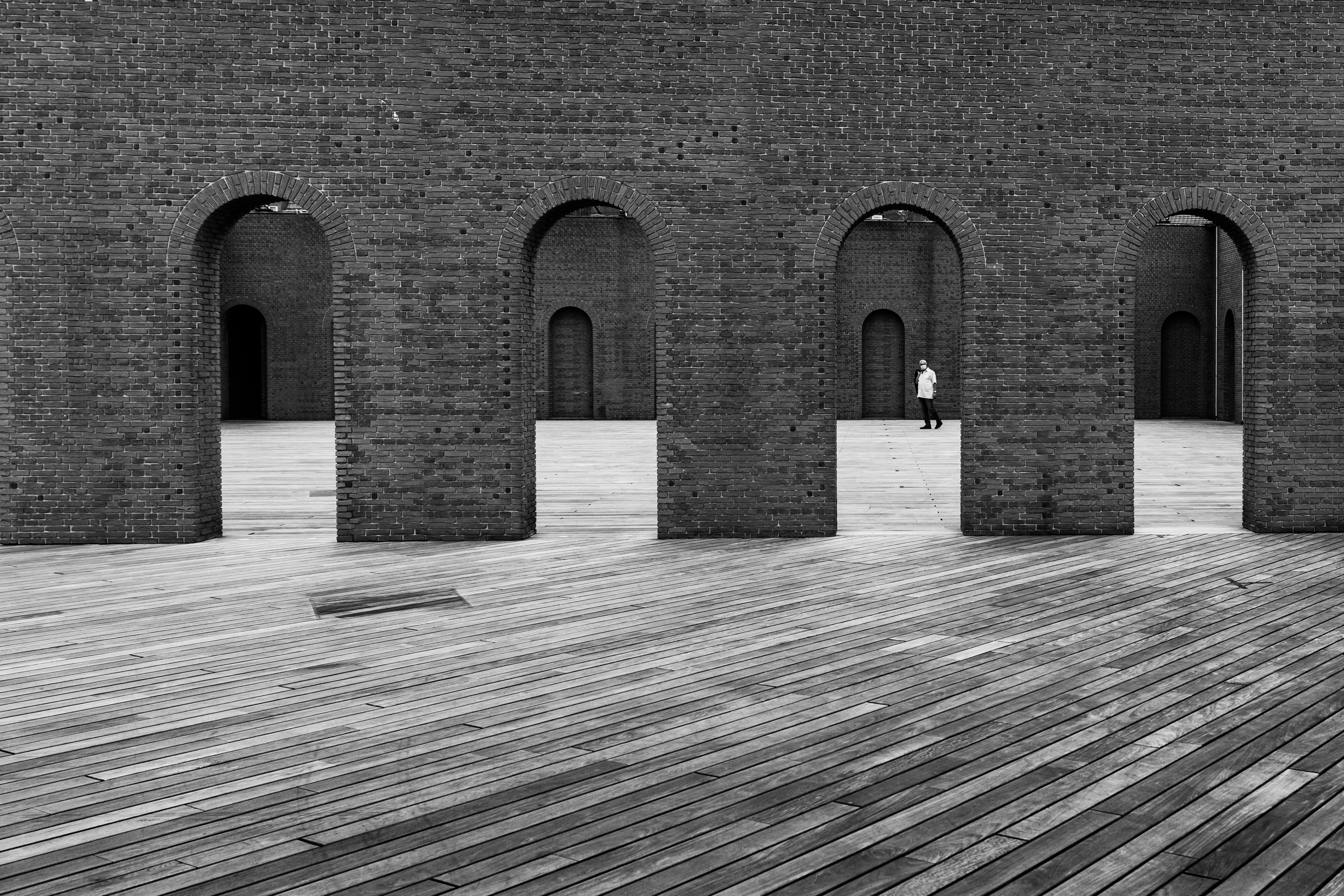 Archways of Silence over a Planked Square