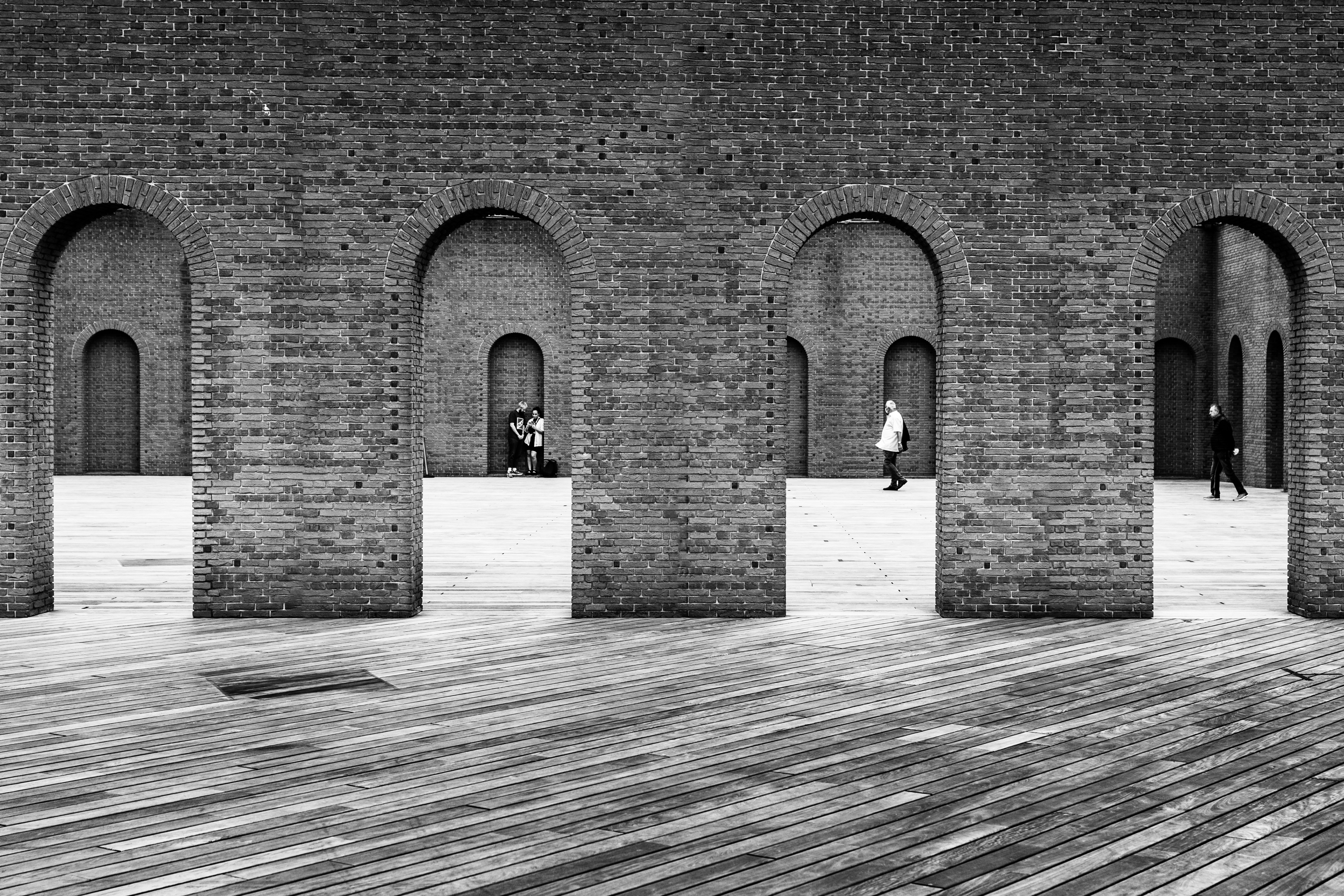 Arched Passage in Quiet Brick Courtyard