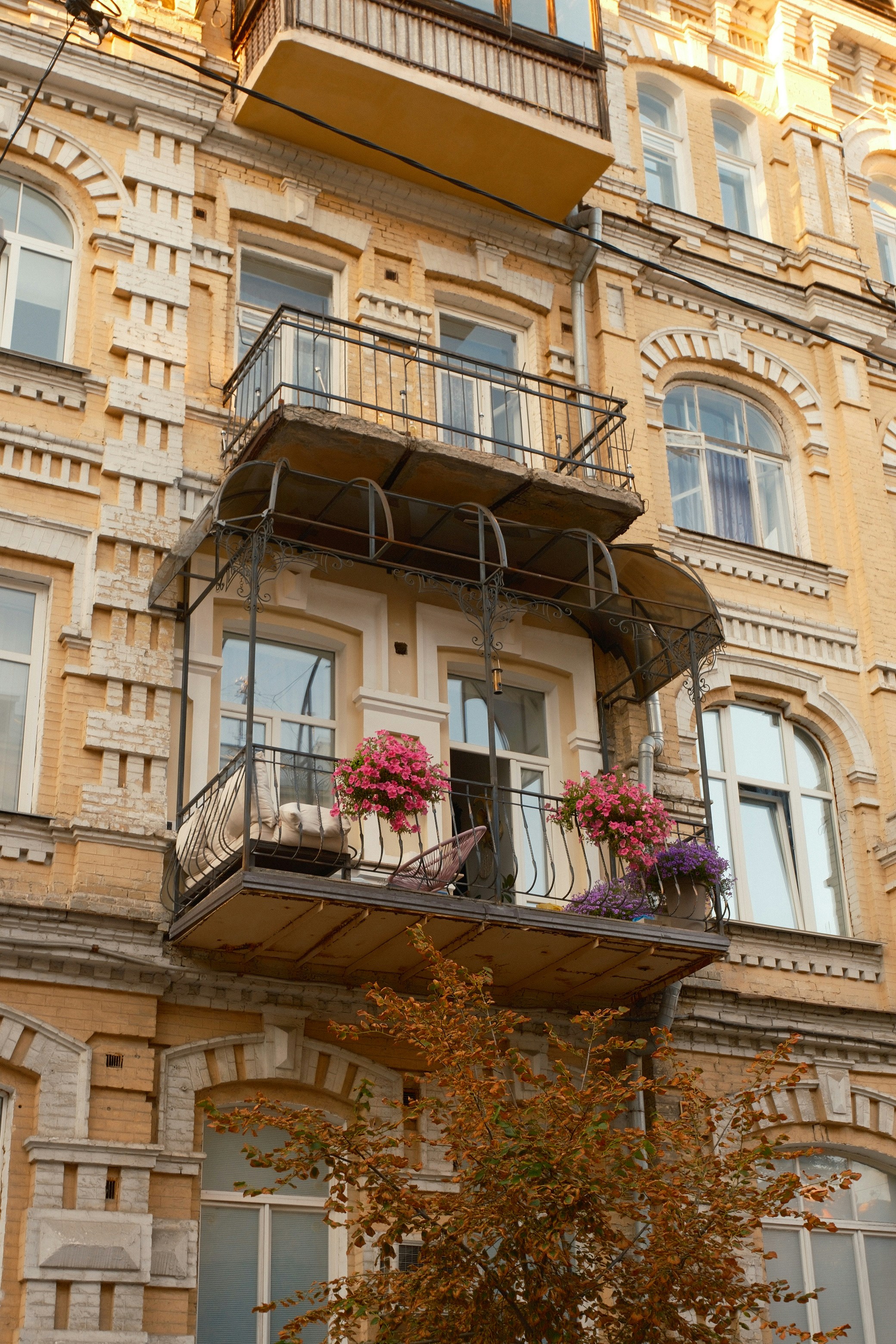 Floral Balcony Portrait on a Corner European Façade