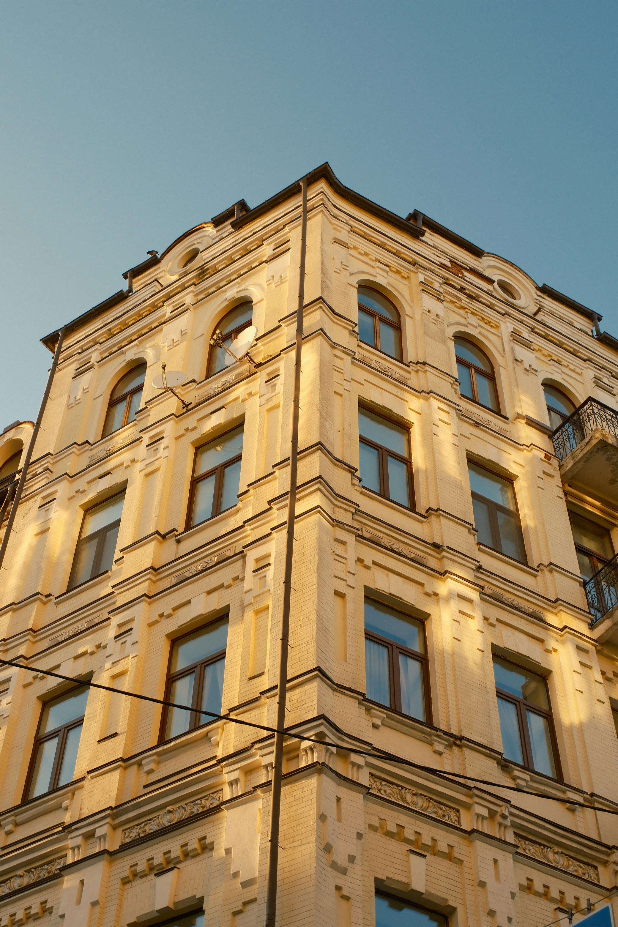 Sunlit facade: a corner view of a classic European building