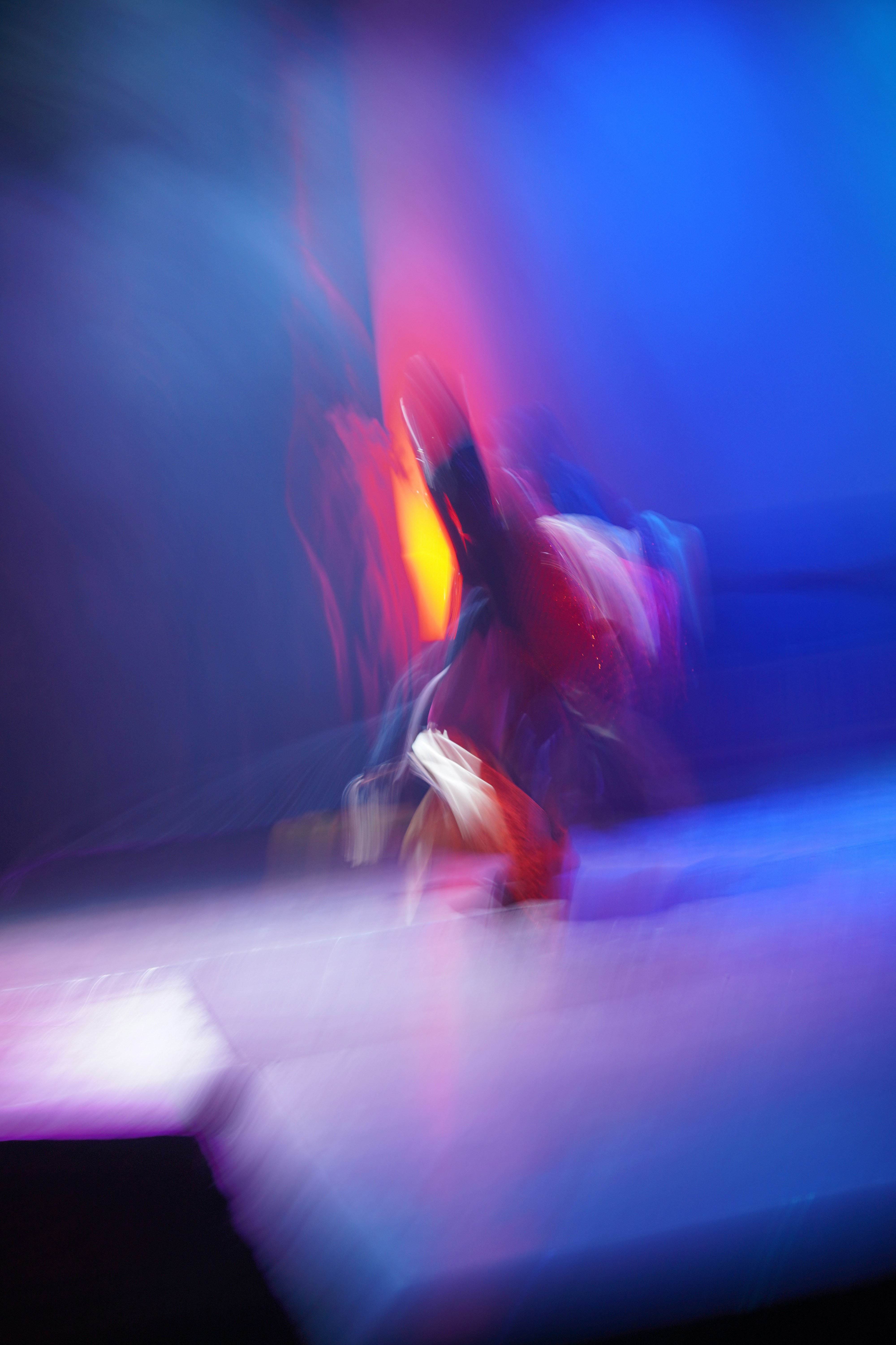 Neon Blur: A Stage Moment in Motion