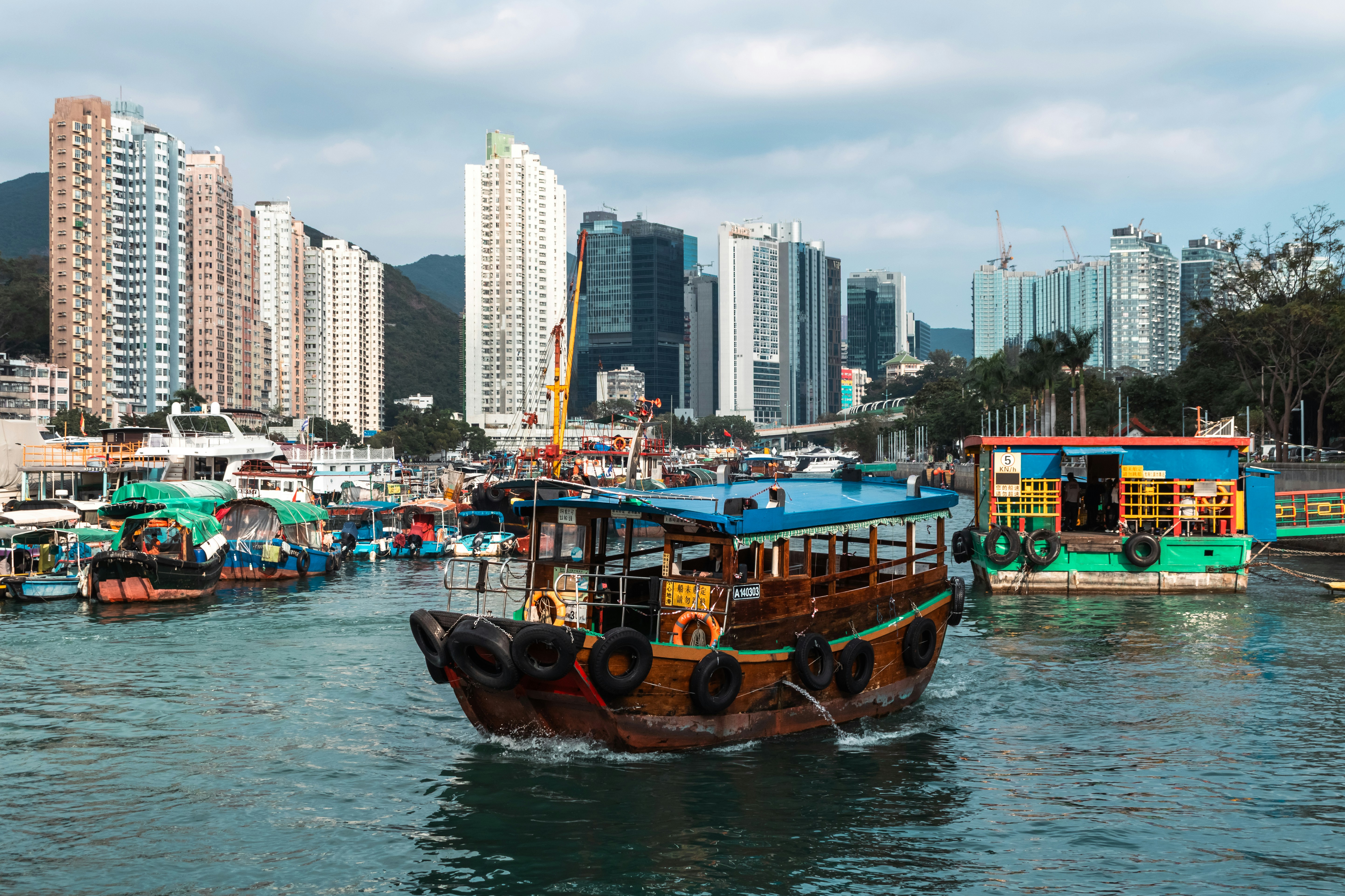 Harbor Hustle: A Boat Parade Against a Shanghai Skyline