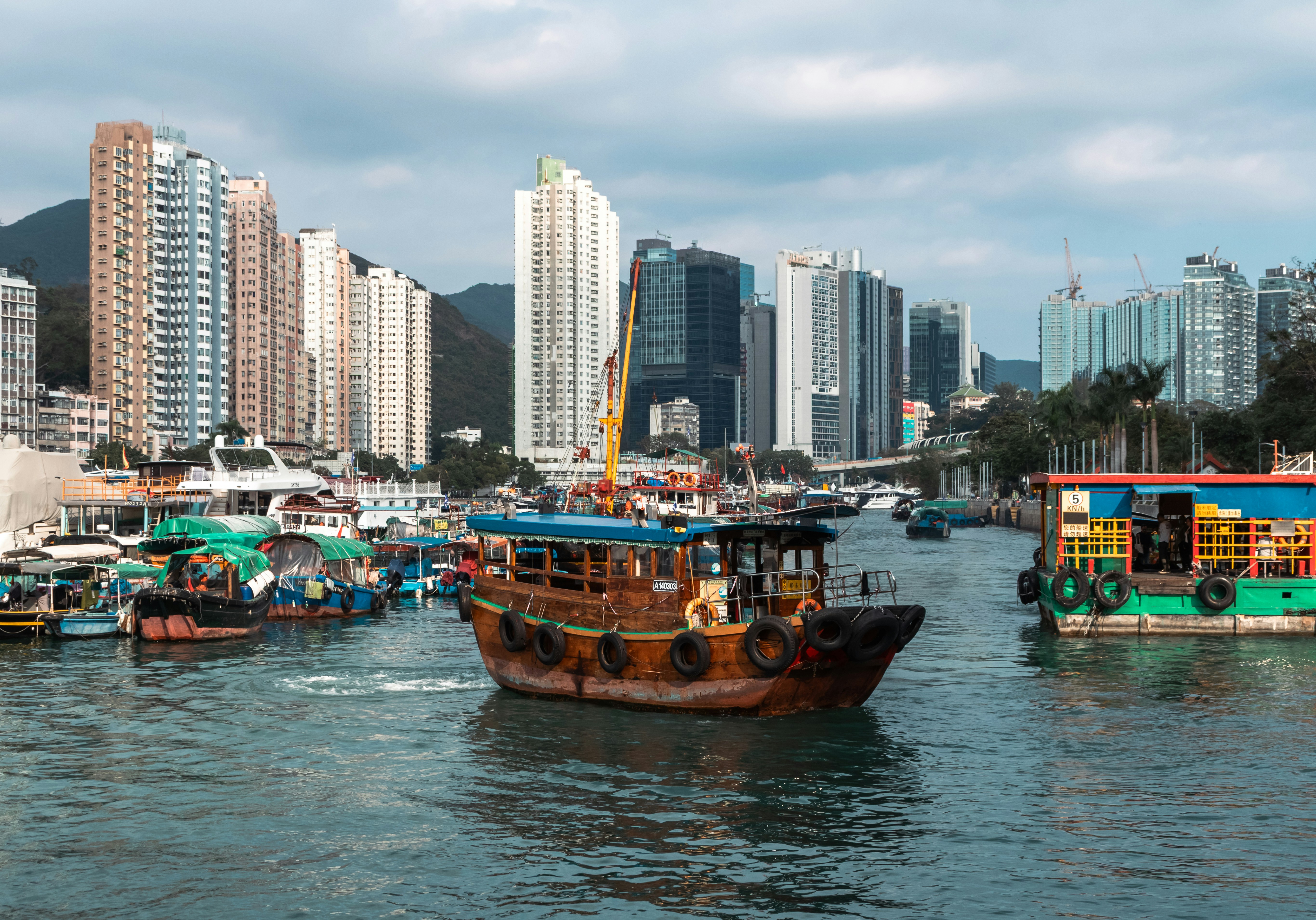 Harbor Convoy: Boats in a Canary City Wake