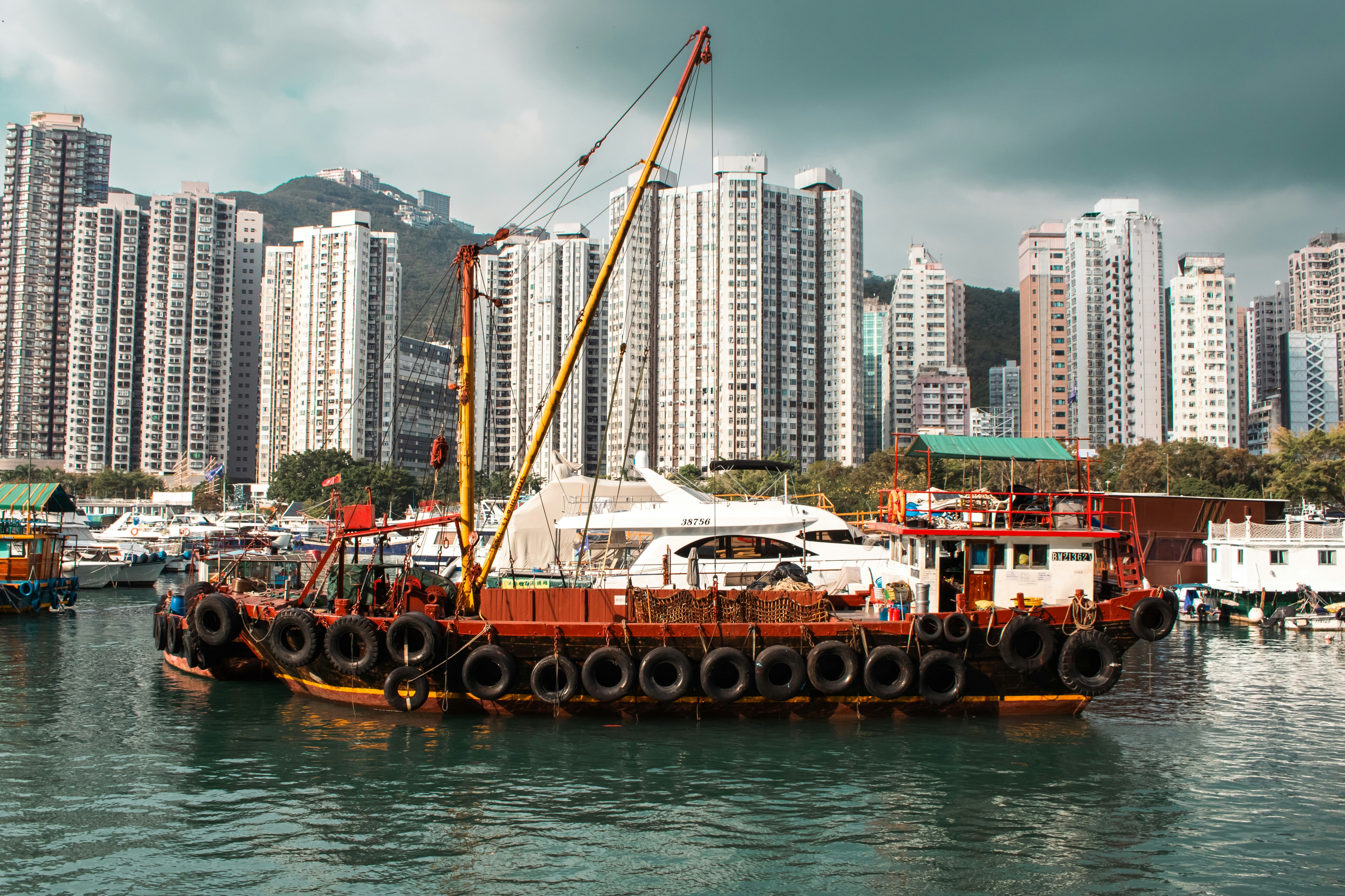 Harbor Workhorse: A Tug-Boat Adrift Among High-Rises