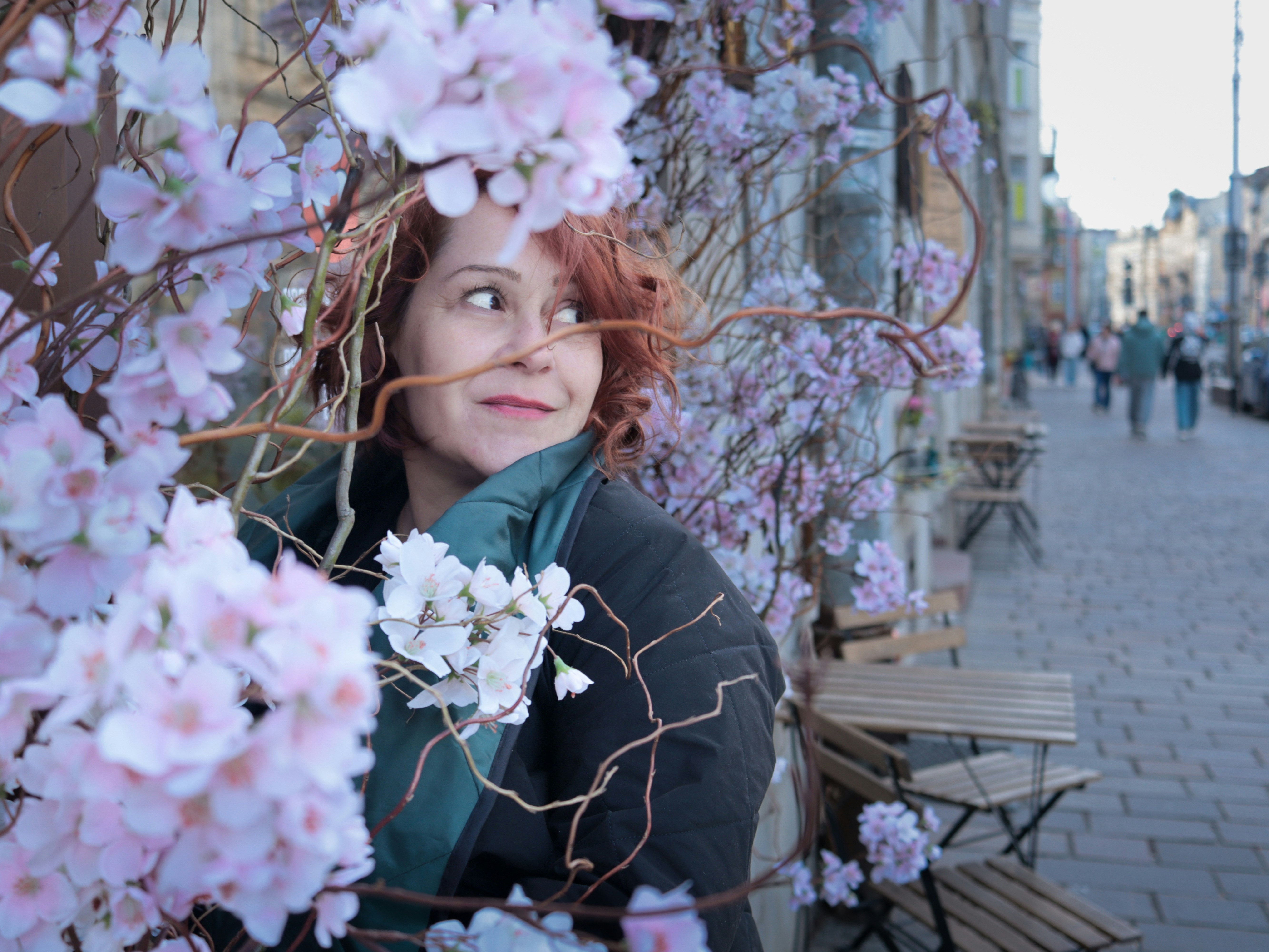 Blossoms and Boulevard: A Portrait Among Pink Trails