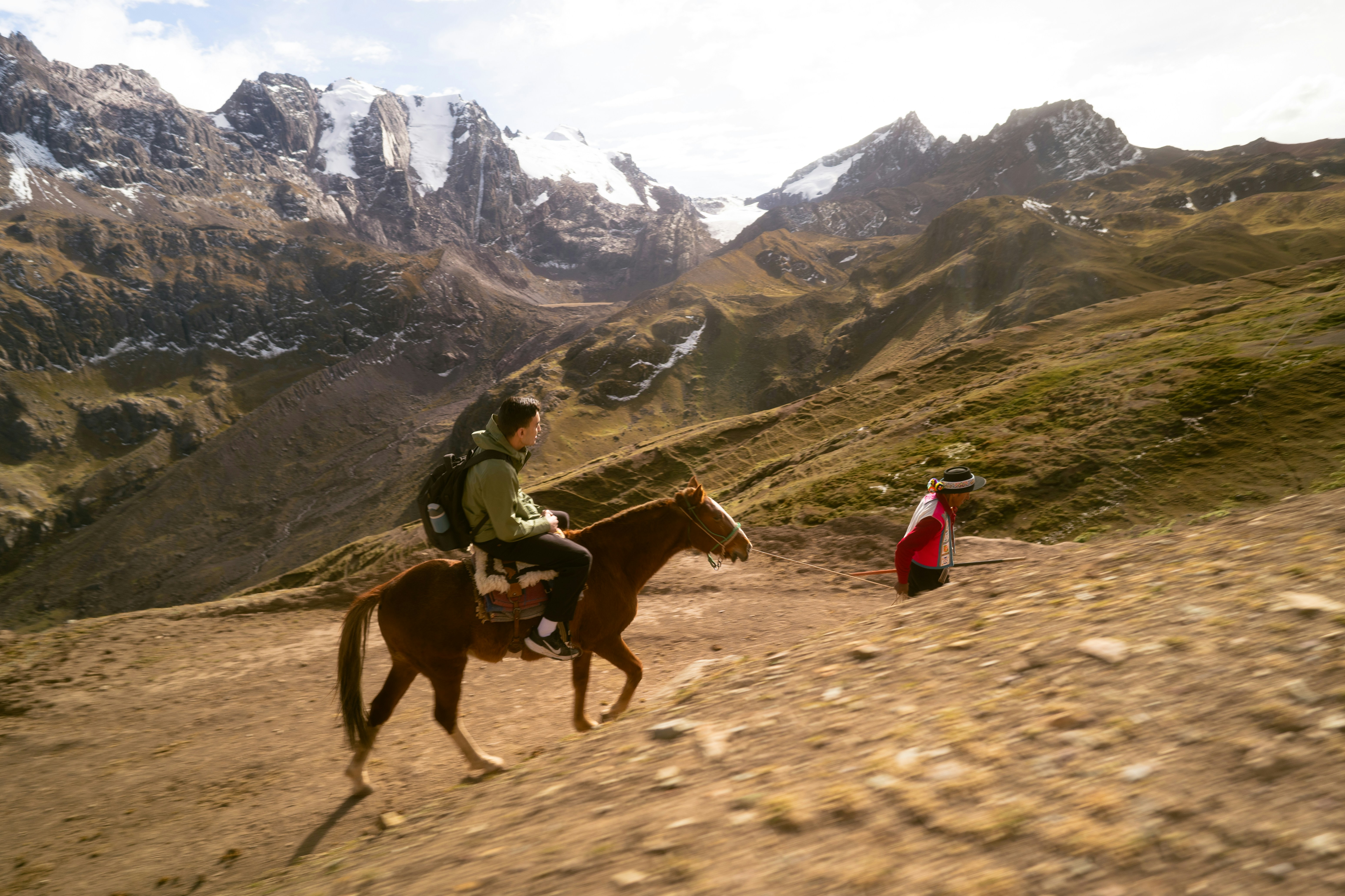 Ridge Ride: A Rider and a Wandering Trader Cross a Mountain Pass