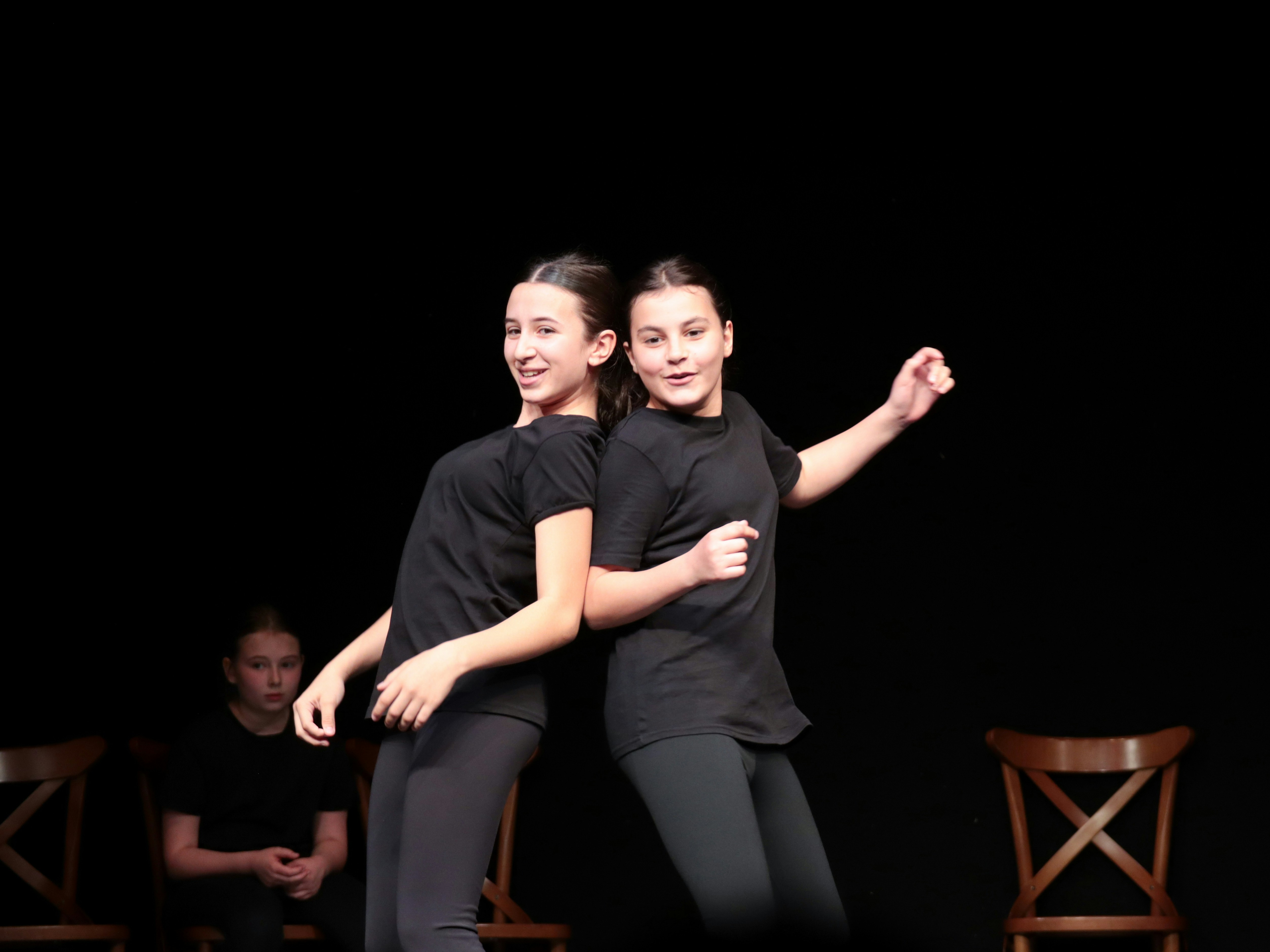 Two-Headed Duo: A Dual-Dance Moment on a Silent Stage