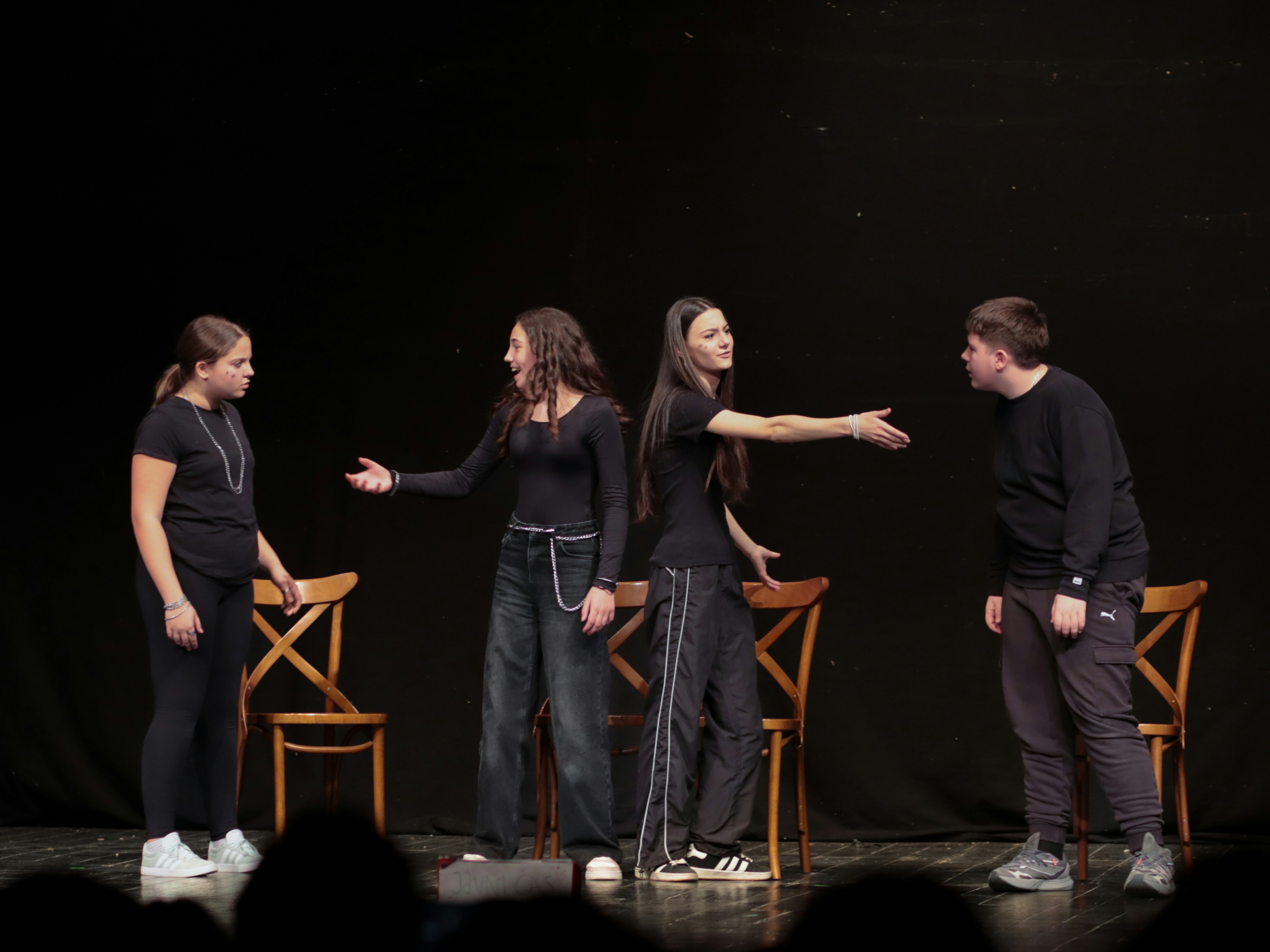Quad of Voices: A Pause on Stage