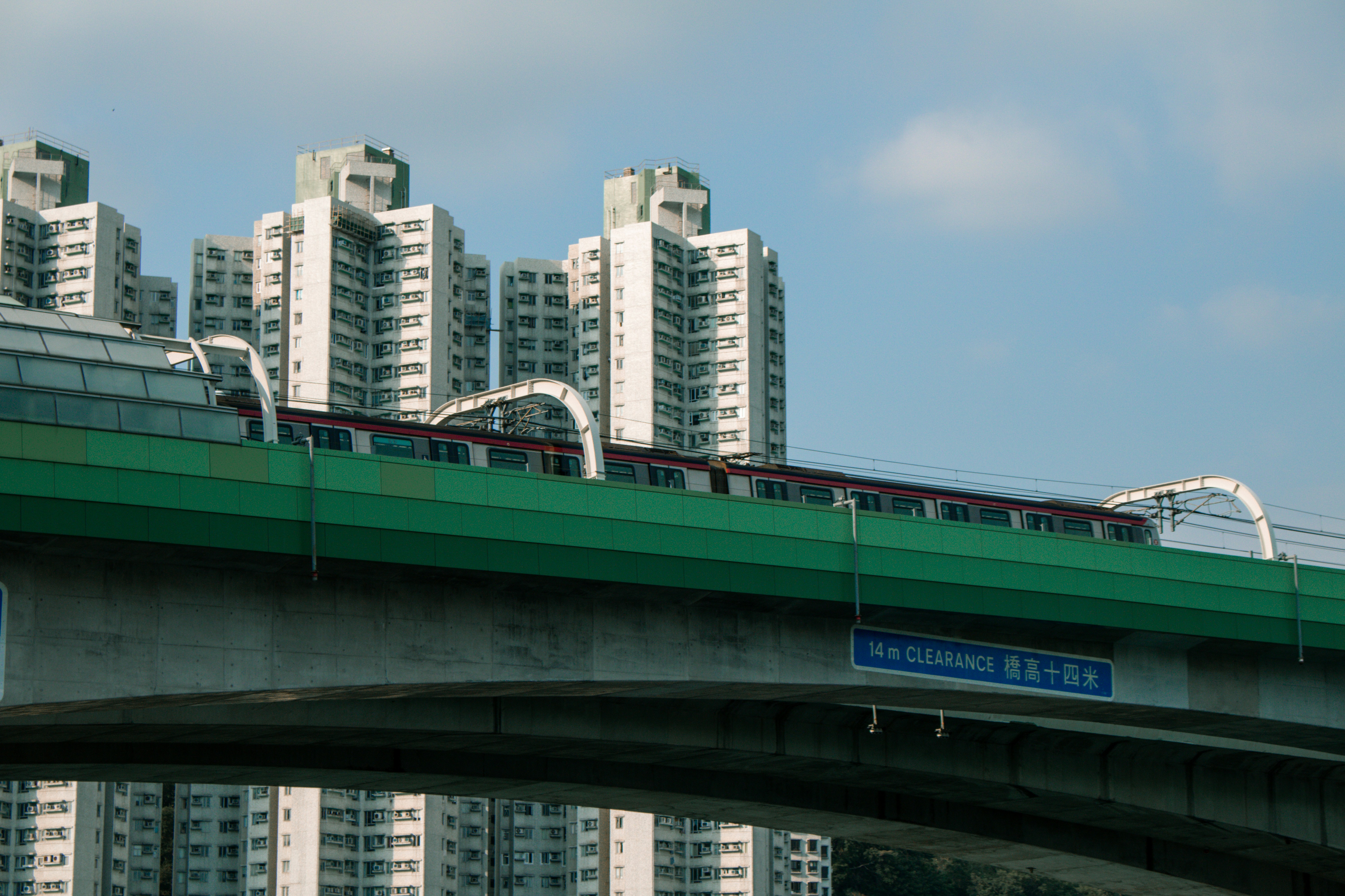 Mid-Air Rhythm: Urban Bridge Framed by Skyscrapers