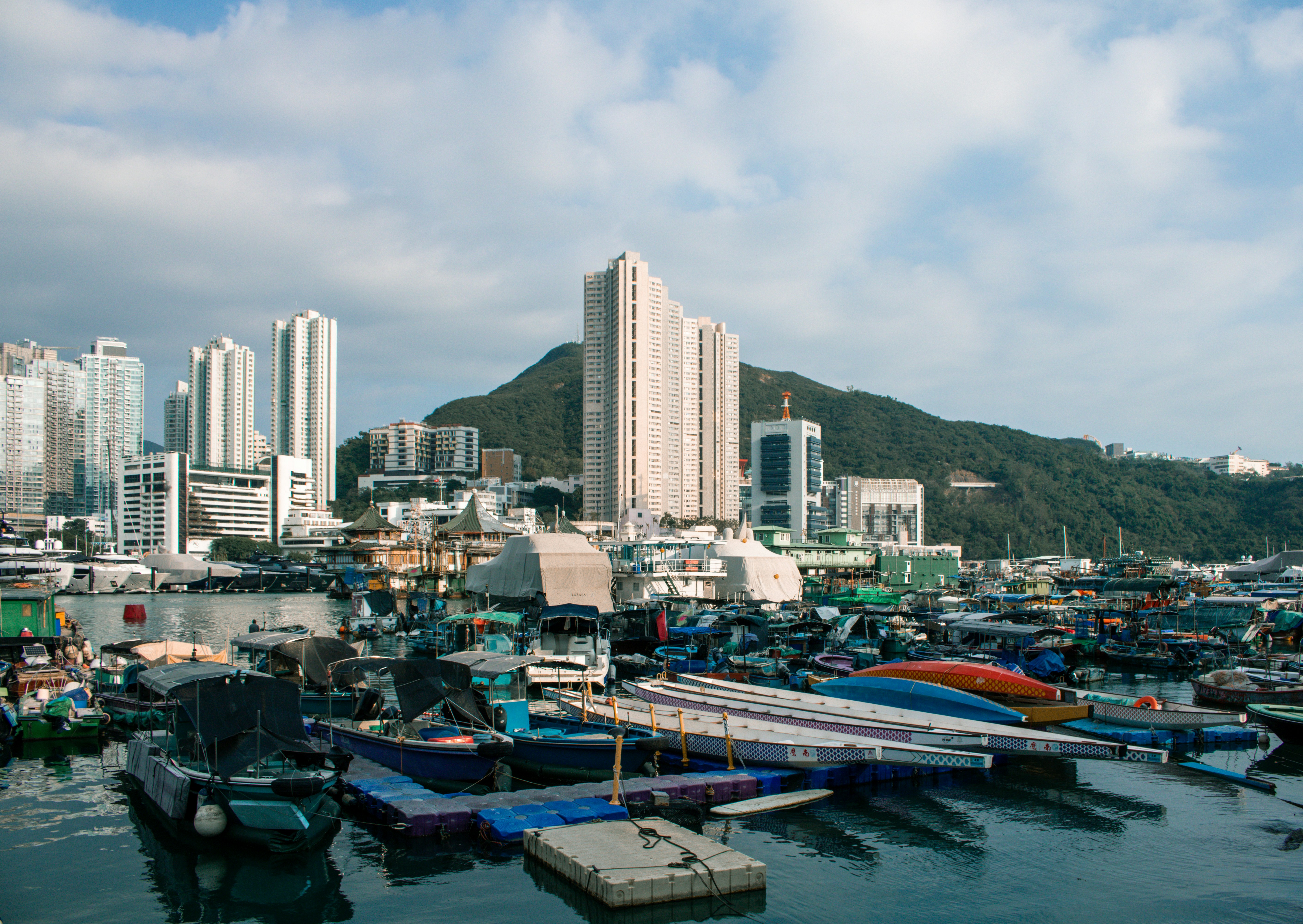 Harbor Silhouette: Skyscrapers Backed by Green Hills