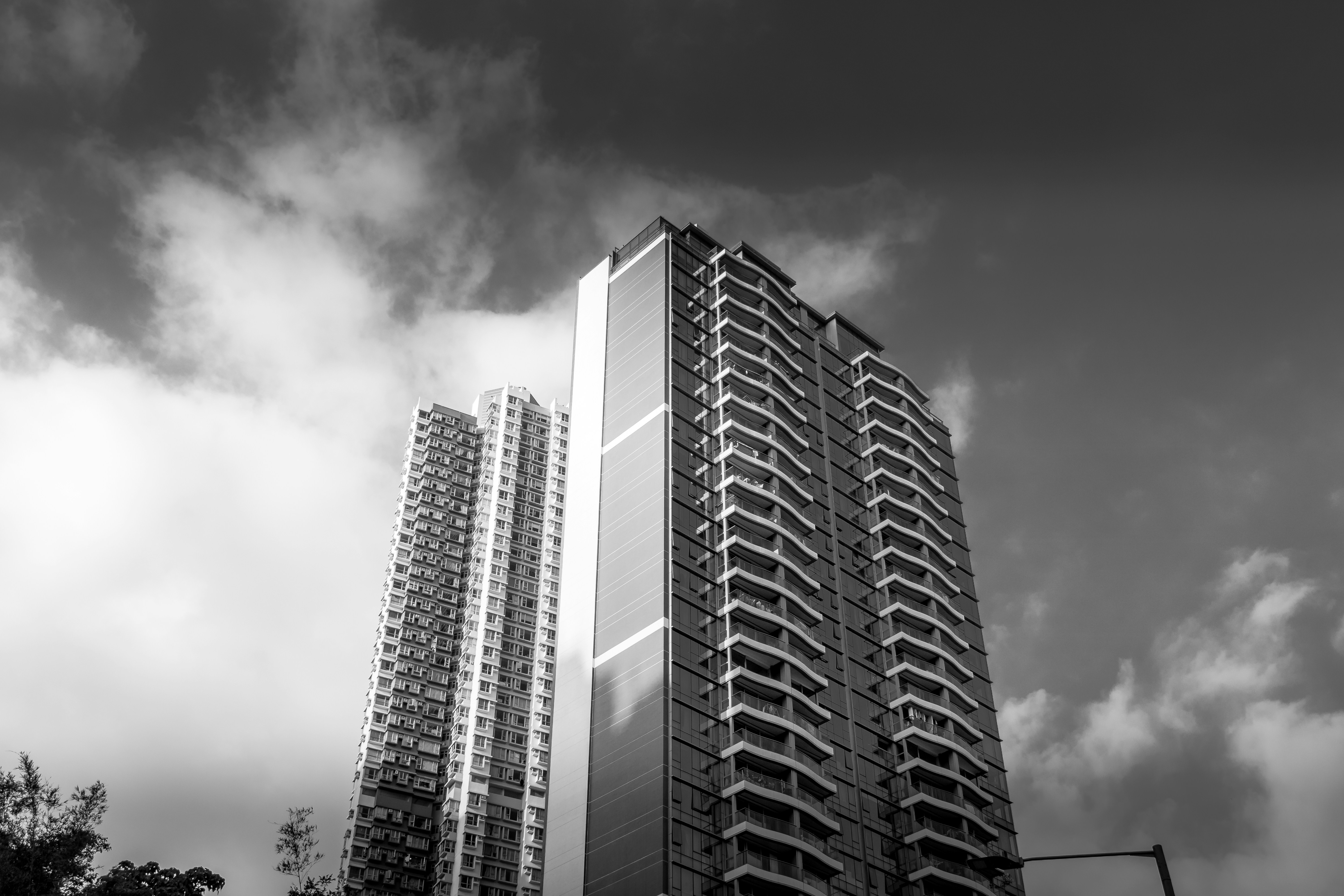 Skyline Ascension: Twin Towers Piercing a Dramatic Cloudscape