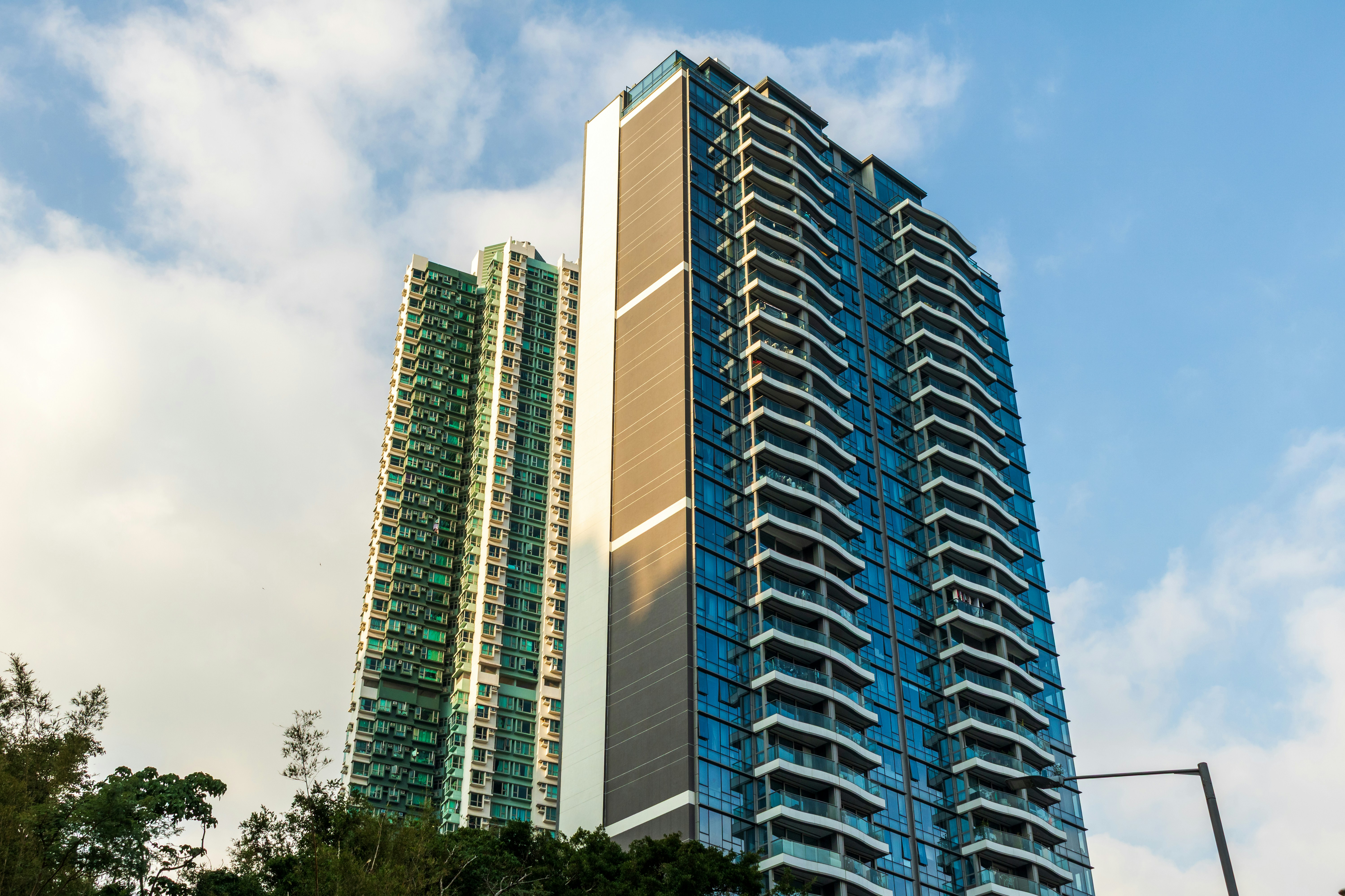 Urban Giants: Twin Towers Reaching Toward a Bright Sky