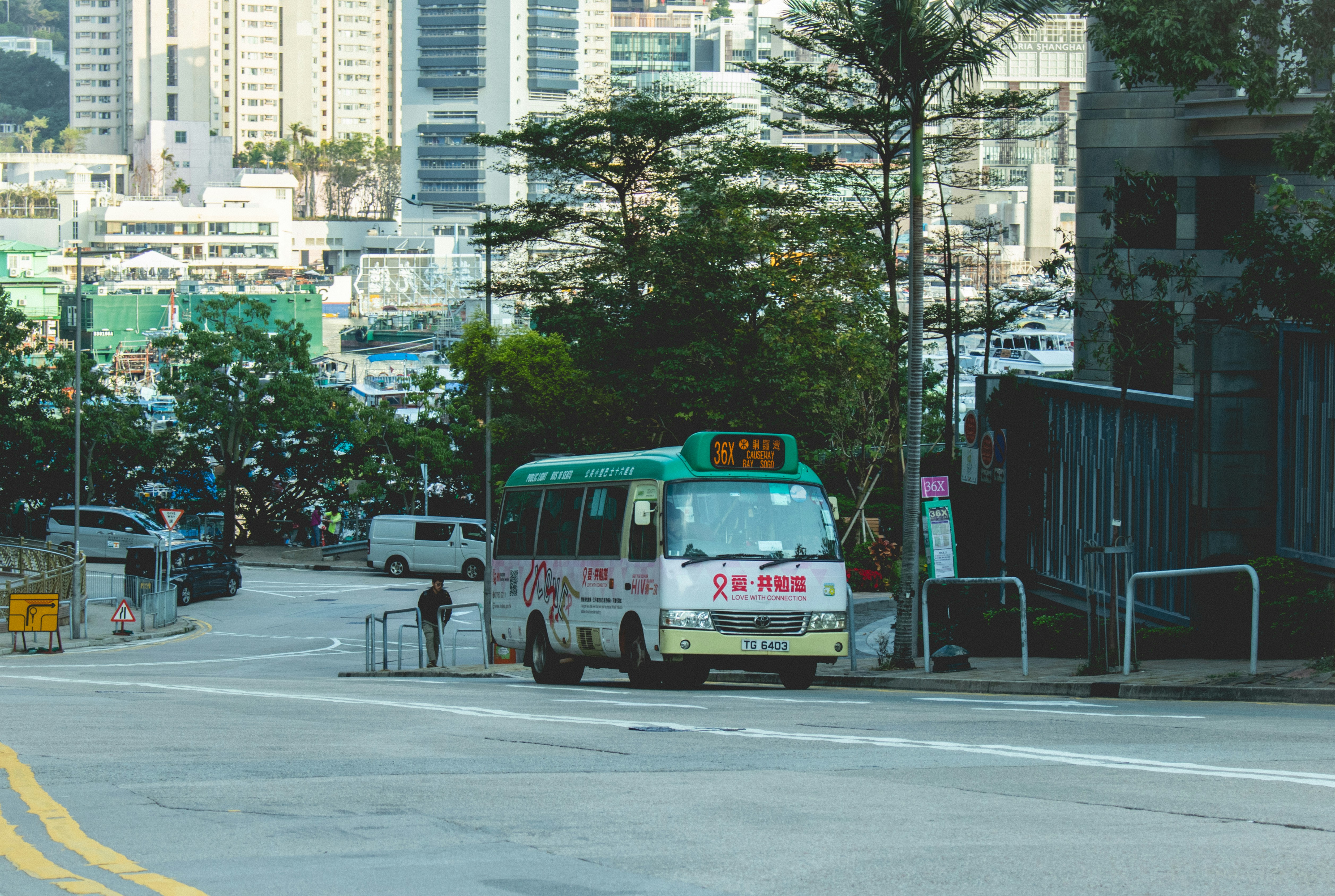 Urban Bus Stop Beneath Skyscraper Shadows