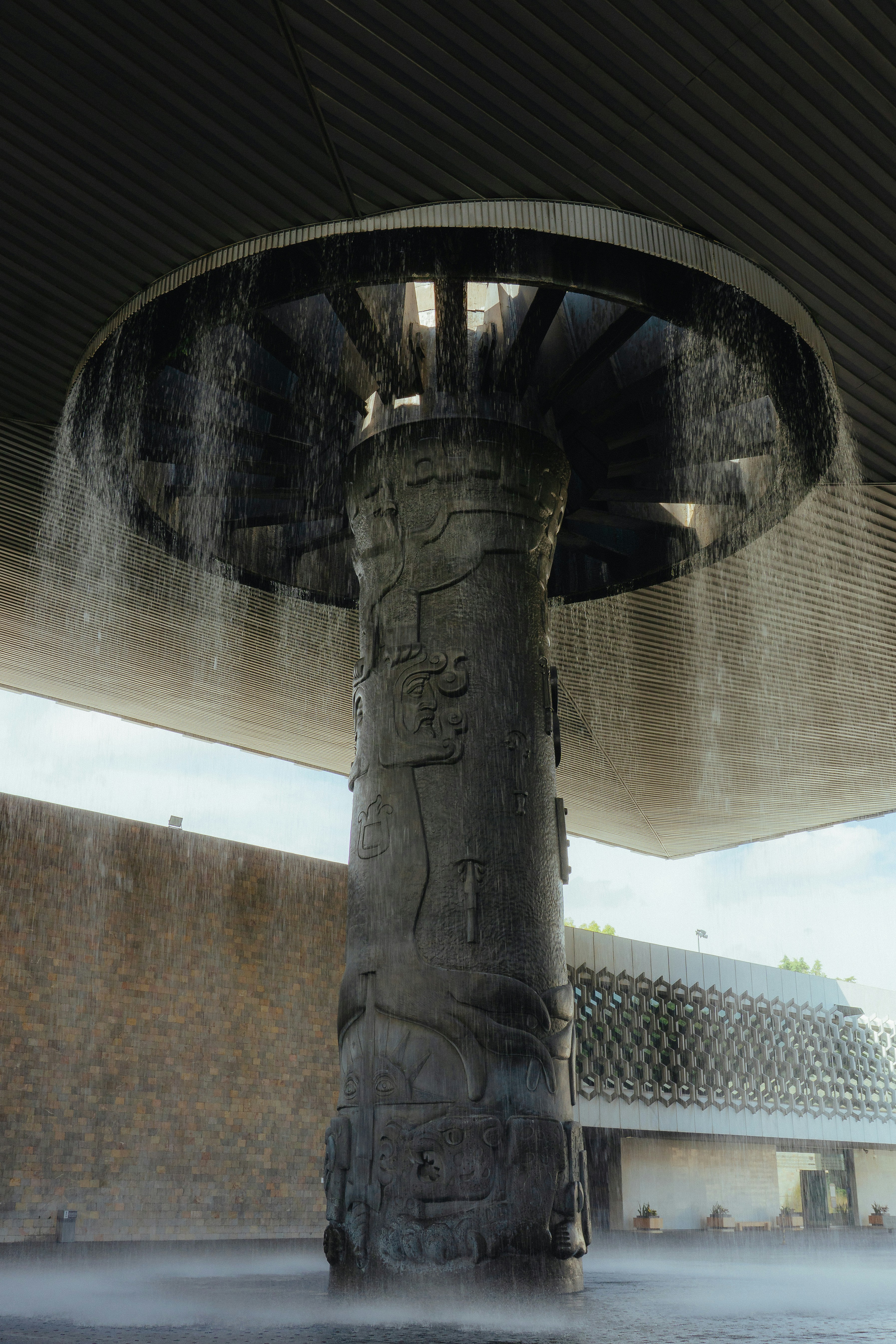 Undercurrent of Time: A Tapered Pillar Beneath a Circular Fountain