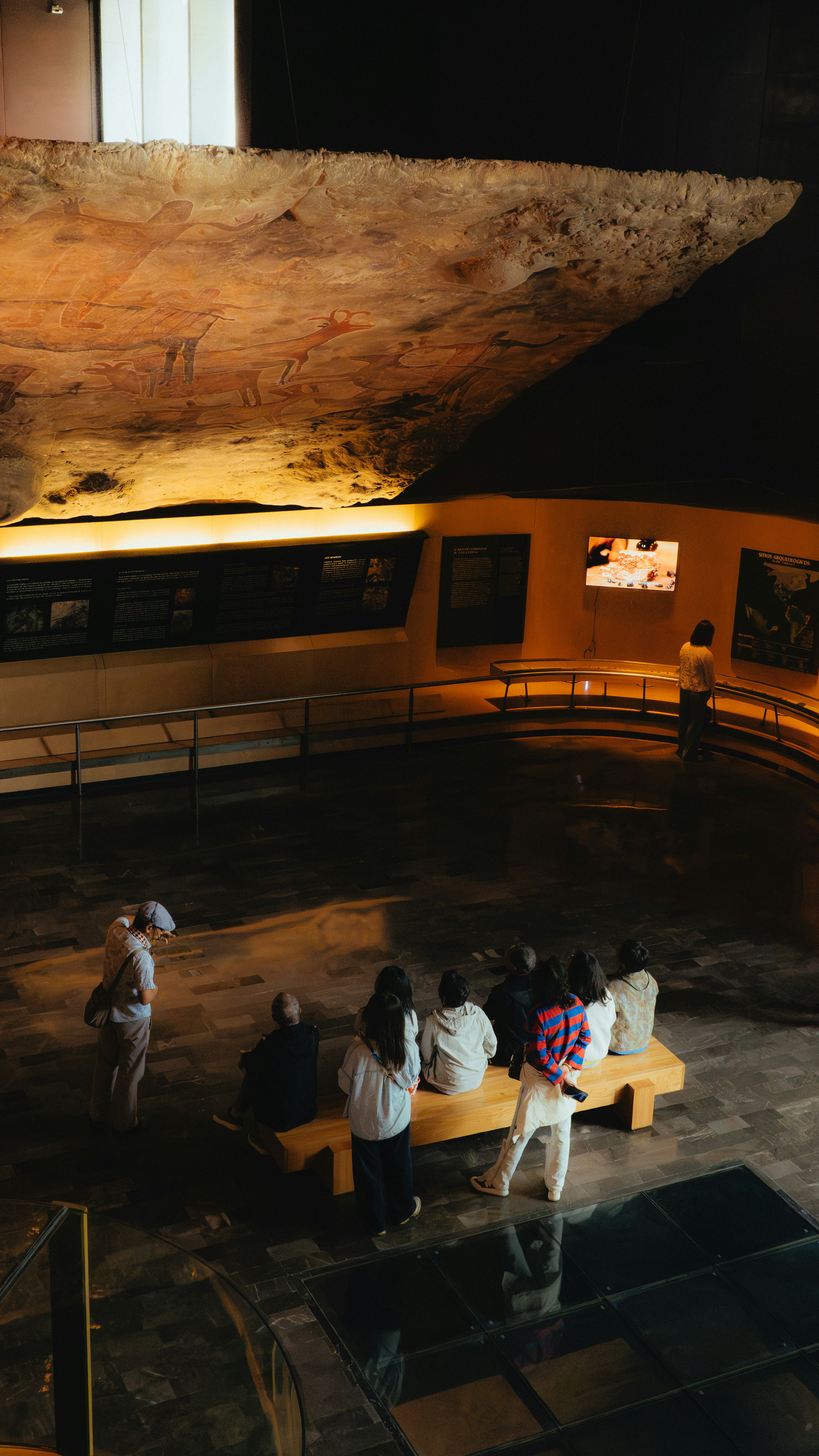 Whispers of the Painted Cave: Visitors in a Dim Museum Under Ancient Ceilings