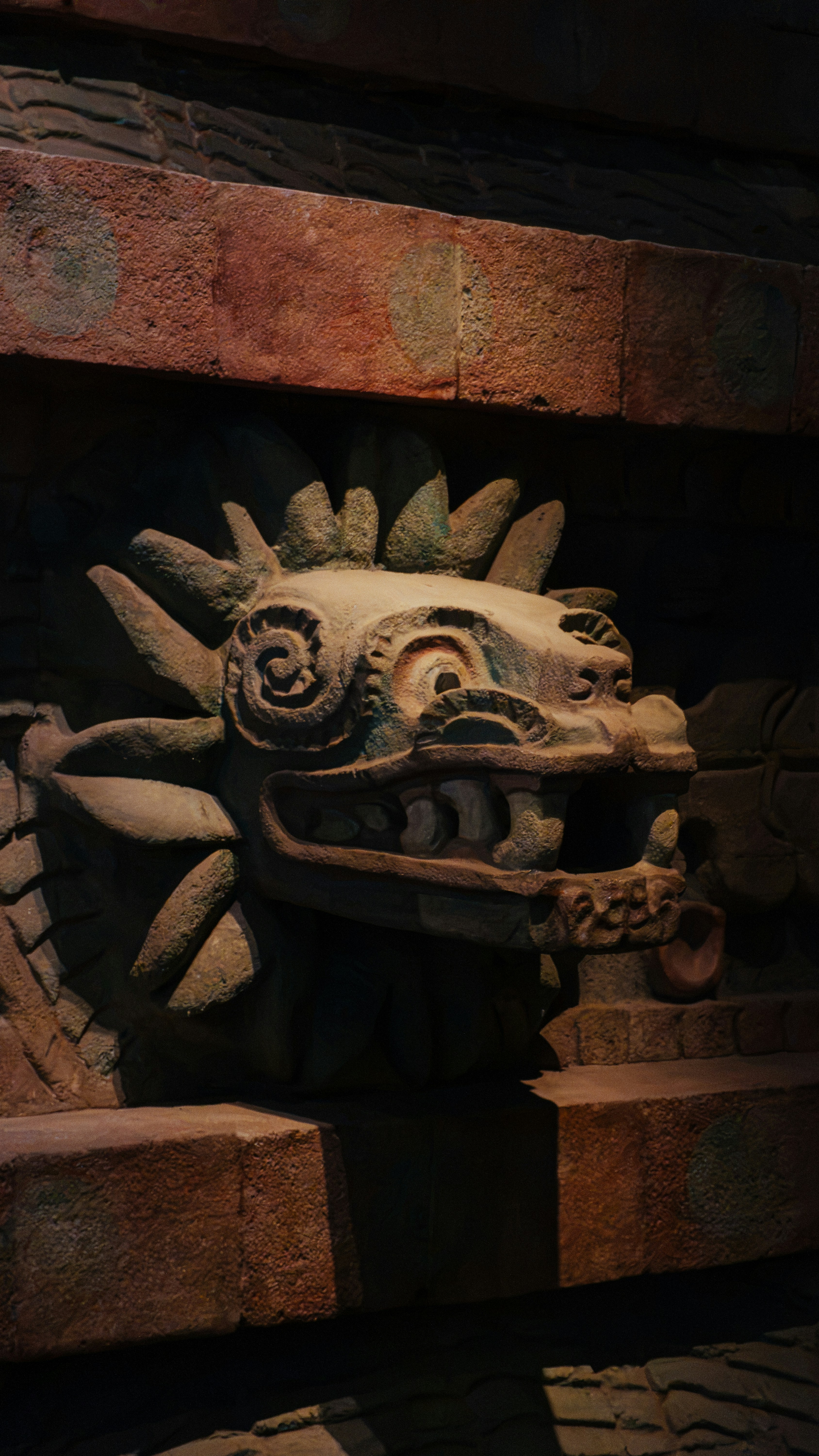 Moonlit Dragon Head Carving Emerges from Stone Wall