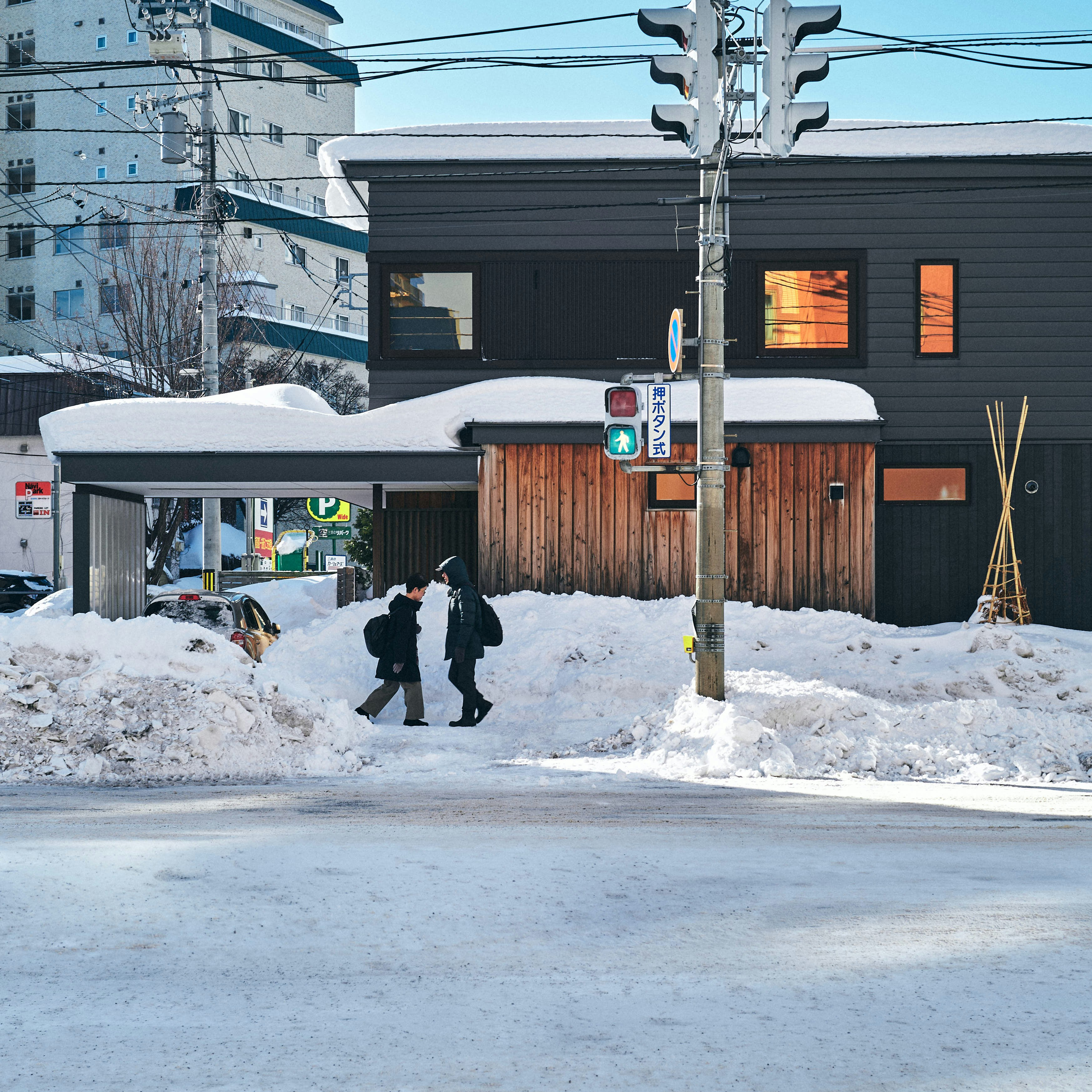 Snow-Filled Crosswalk: Pedestrians in Quiet Winter Street