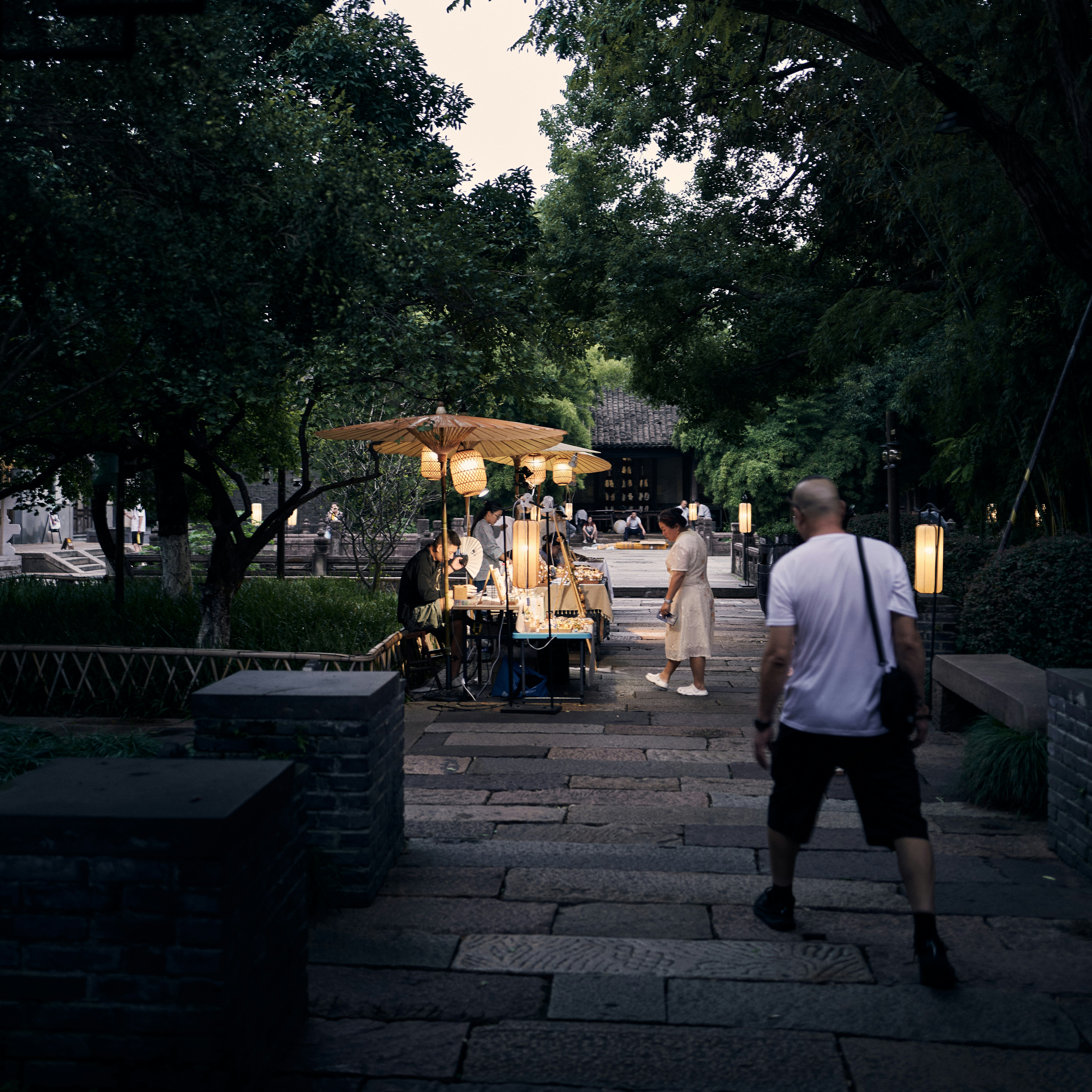 Evening Market Glow in an Ancient Stone Walkway