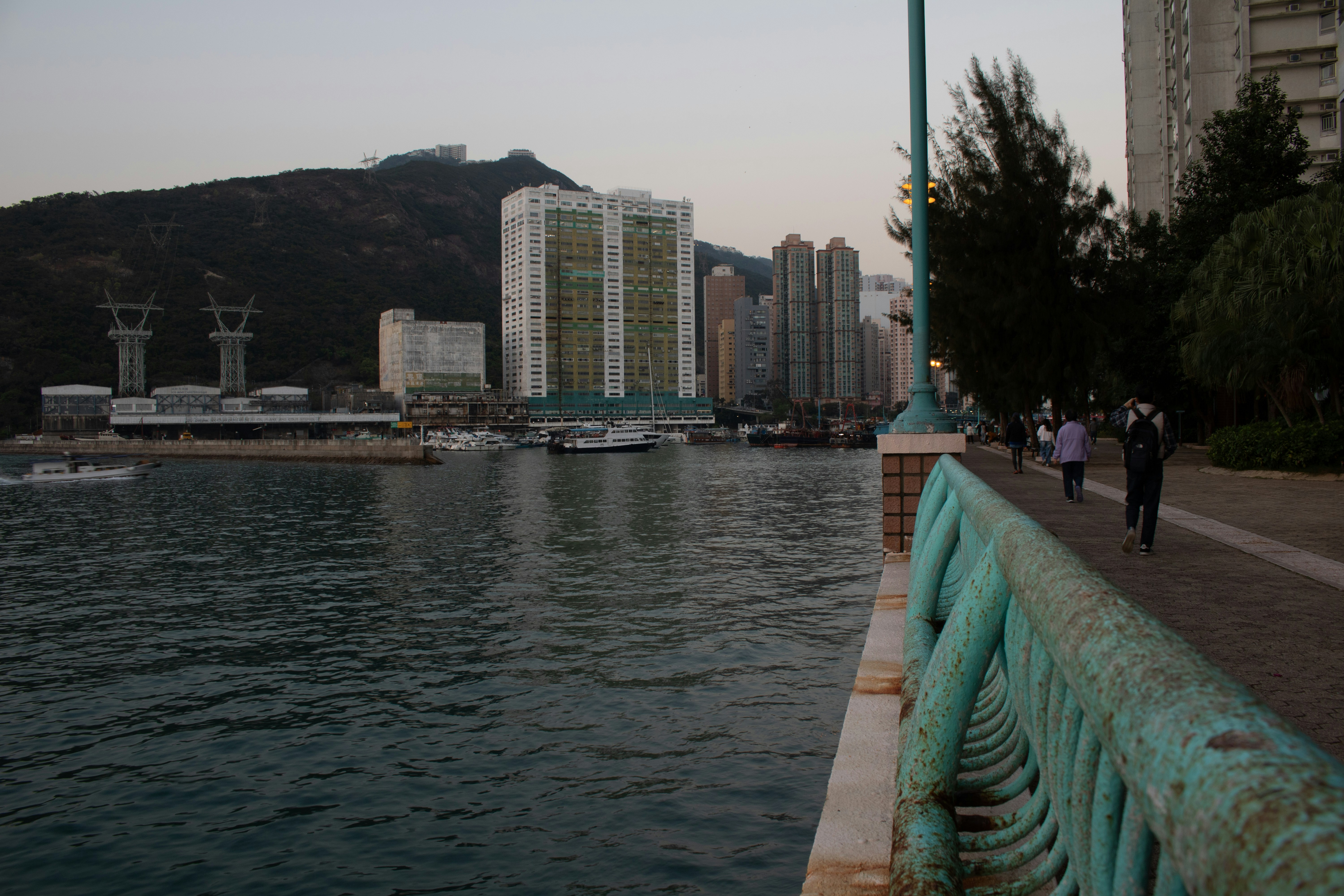 Riverside Promenade: Toward the City amid a Quiet Evening