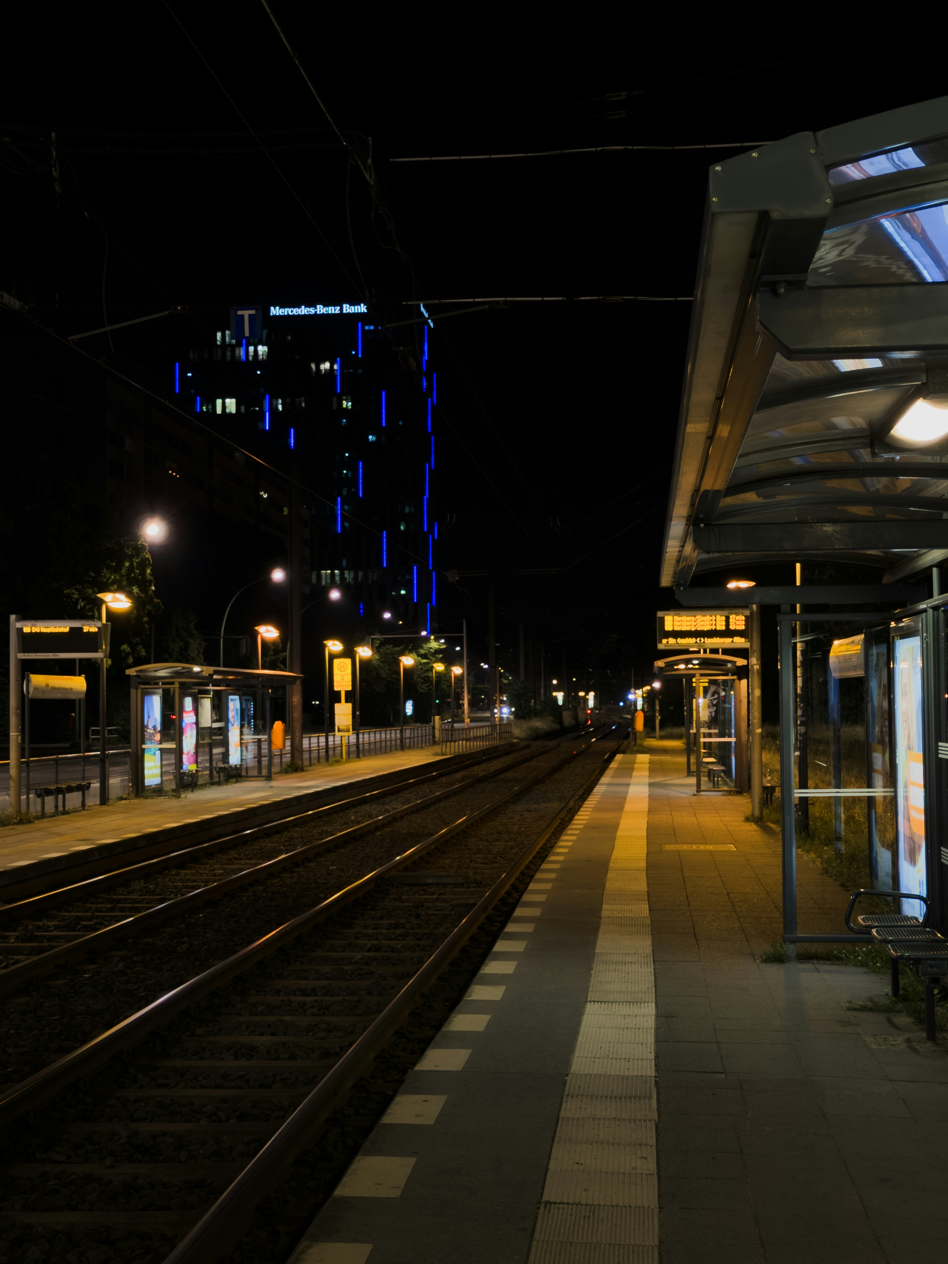 Night Rails: Quiet Platform Under Neon Skyline