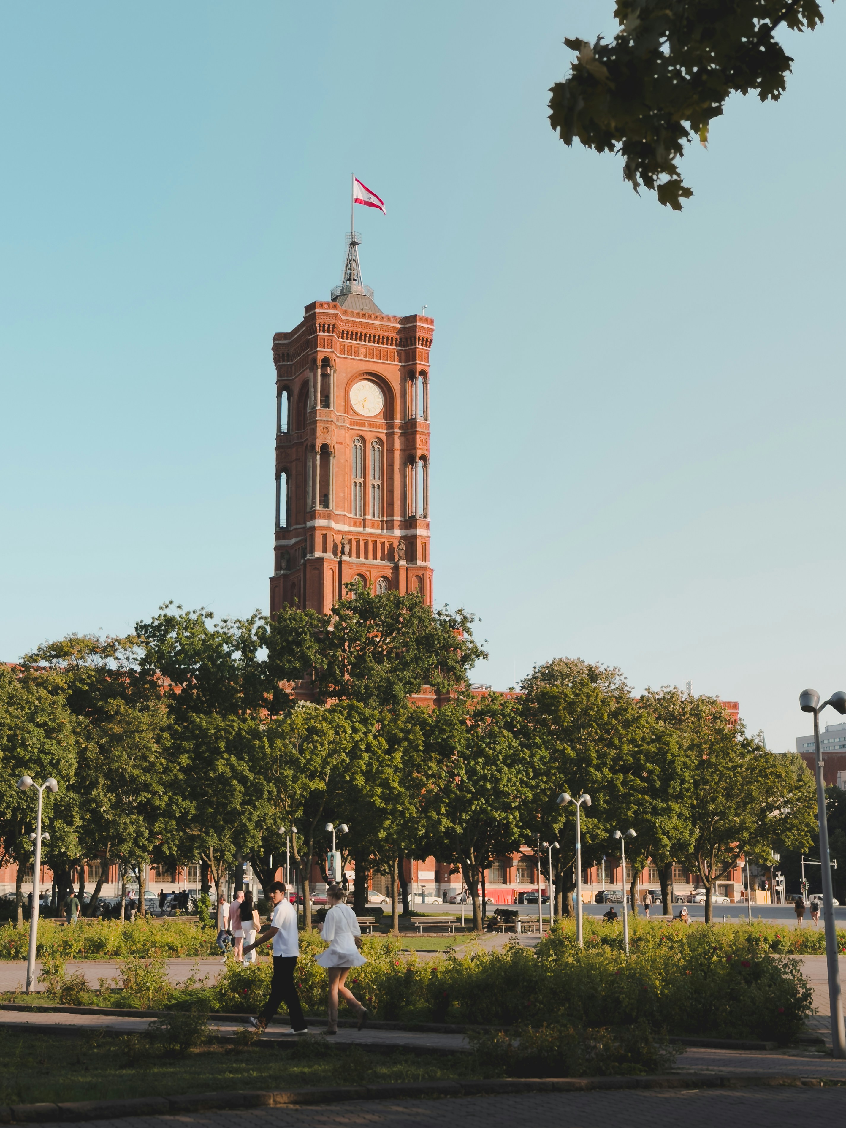 Clock Tower Rising Above a Lime–Green Park