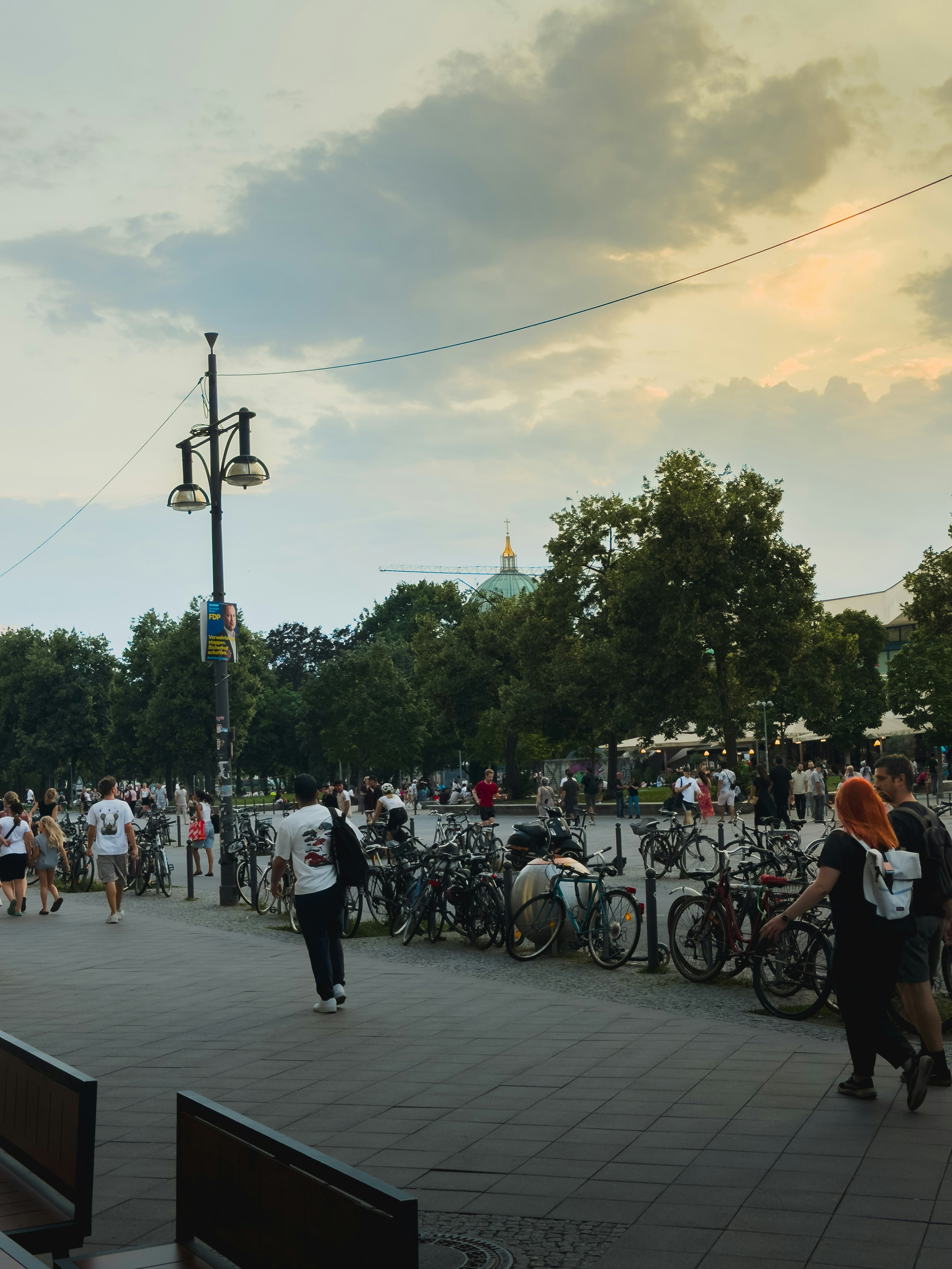City Square at Dusk: A Quiet Moment Amid Bicycles and Silhouettes
