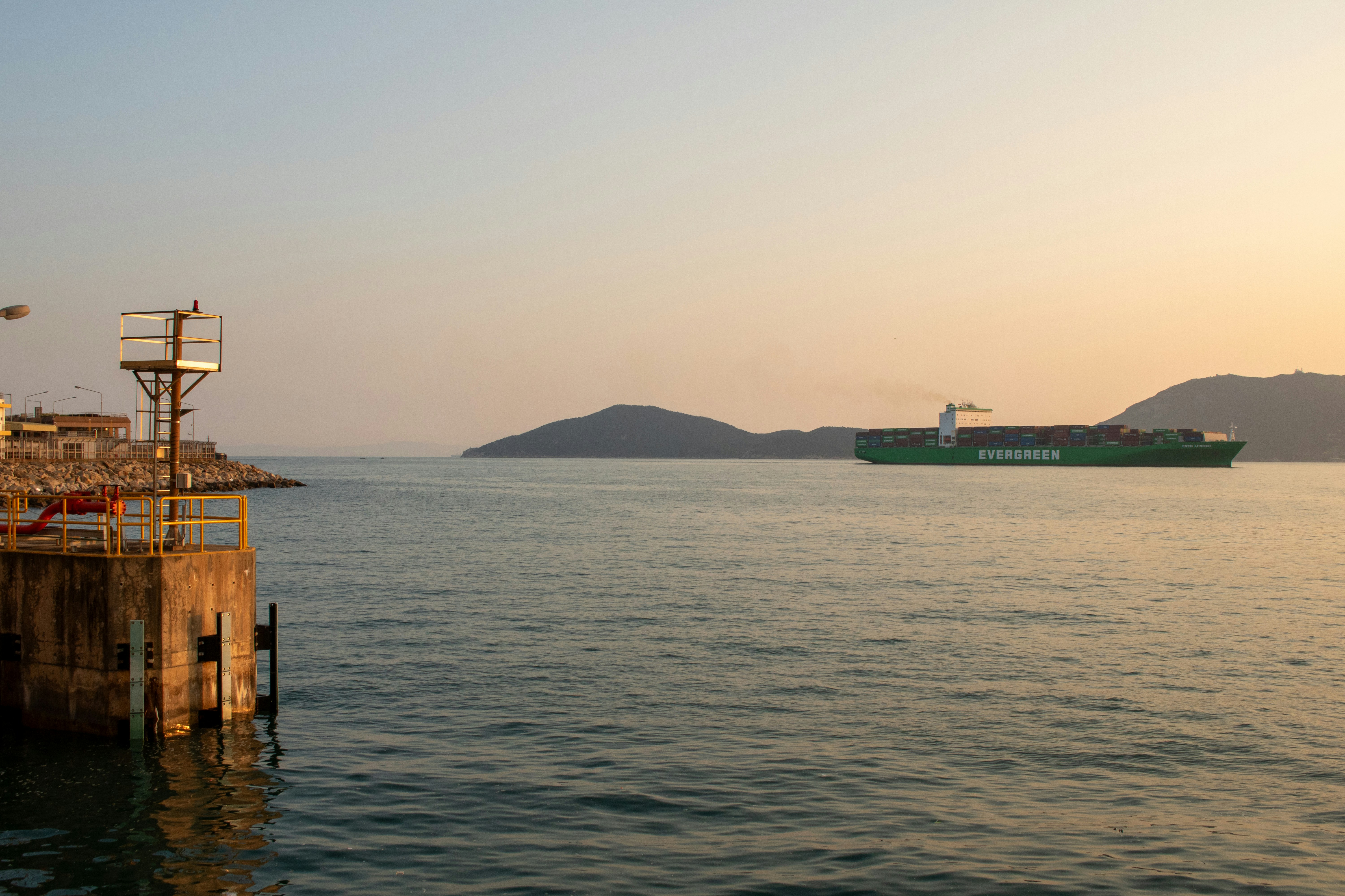 Harbor at Dusk: A Quiet Convergence of Ocean, Vessel, and Sky