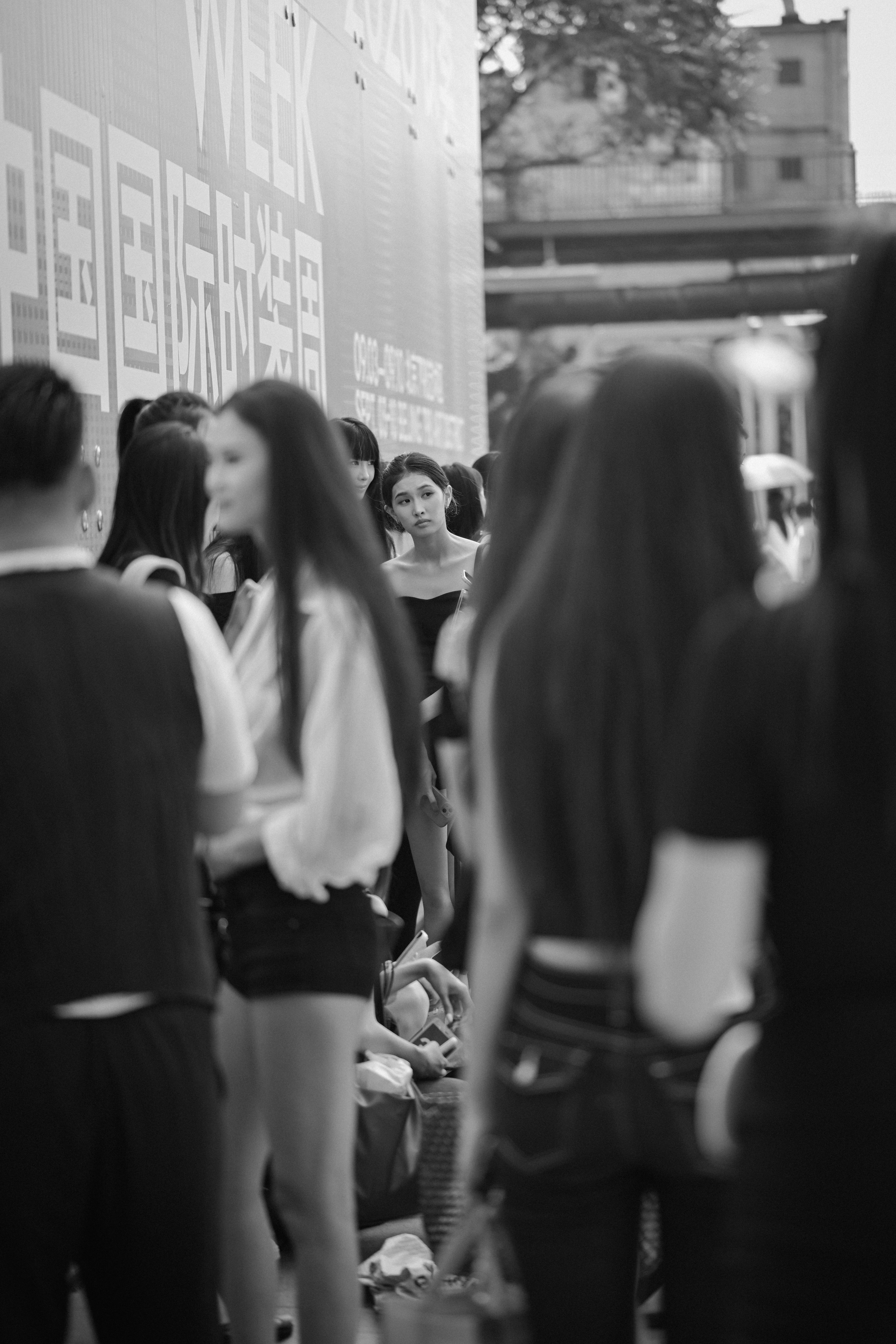Eyes in the Crowd: A Quiet Focal Point Amid the Flux