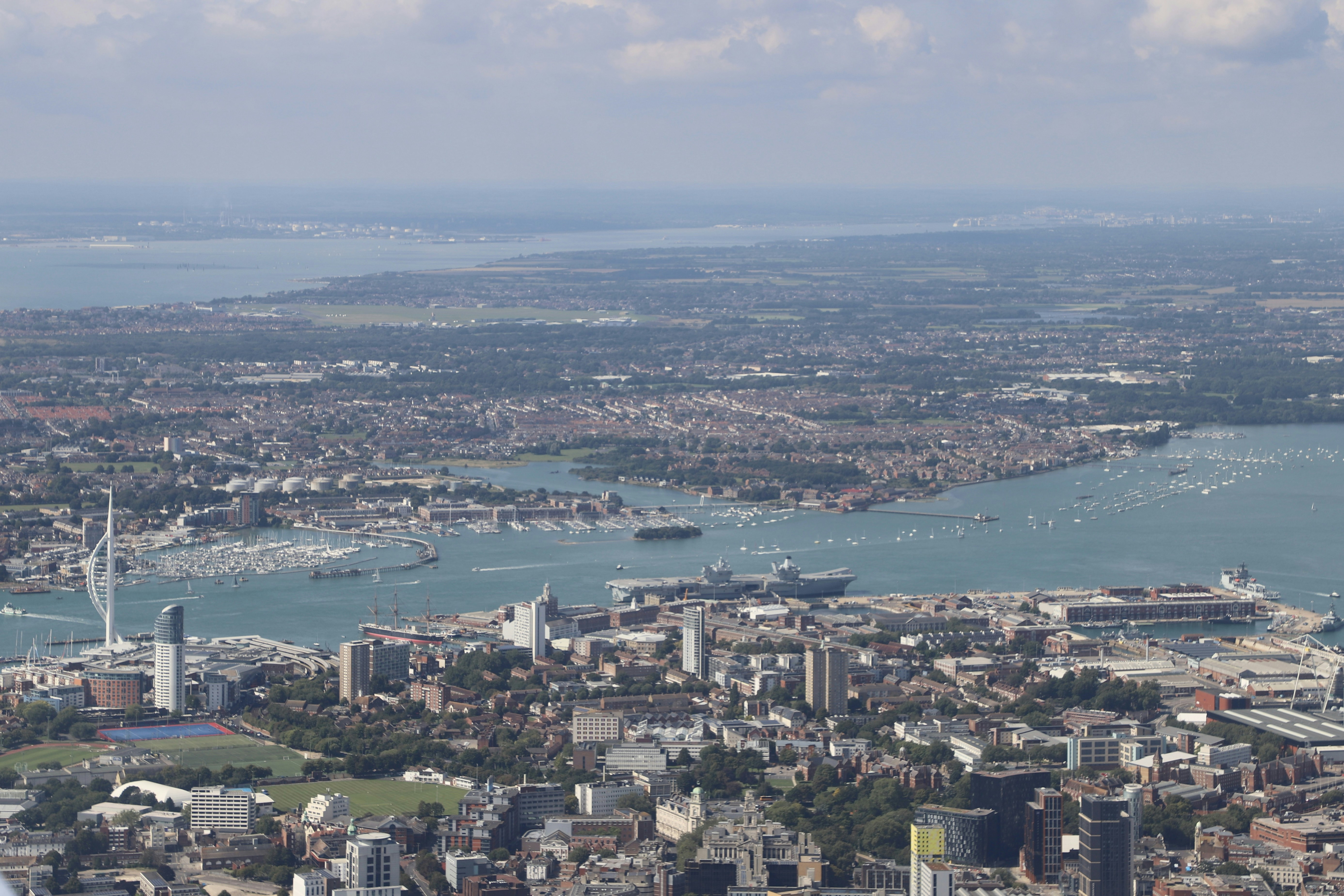 Aerial Cityscape Over the River Amid Distant Shoreline