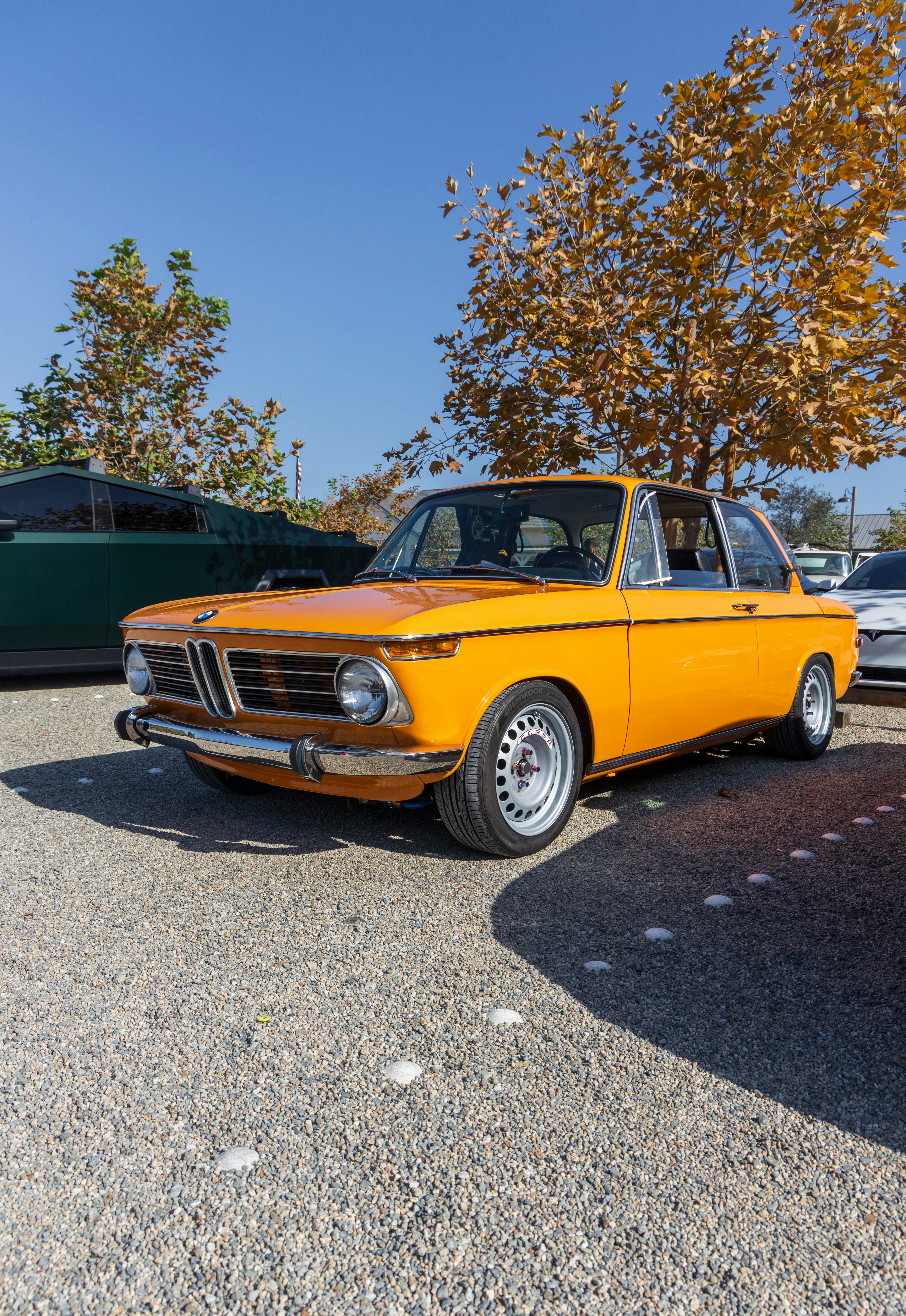 Orange Classic: A Sunlit BMW in a Sunlit Car Lot