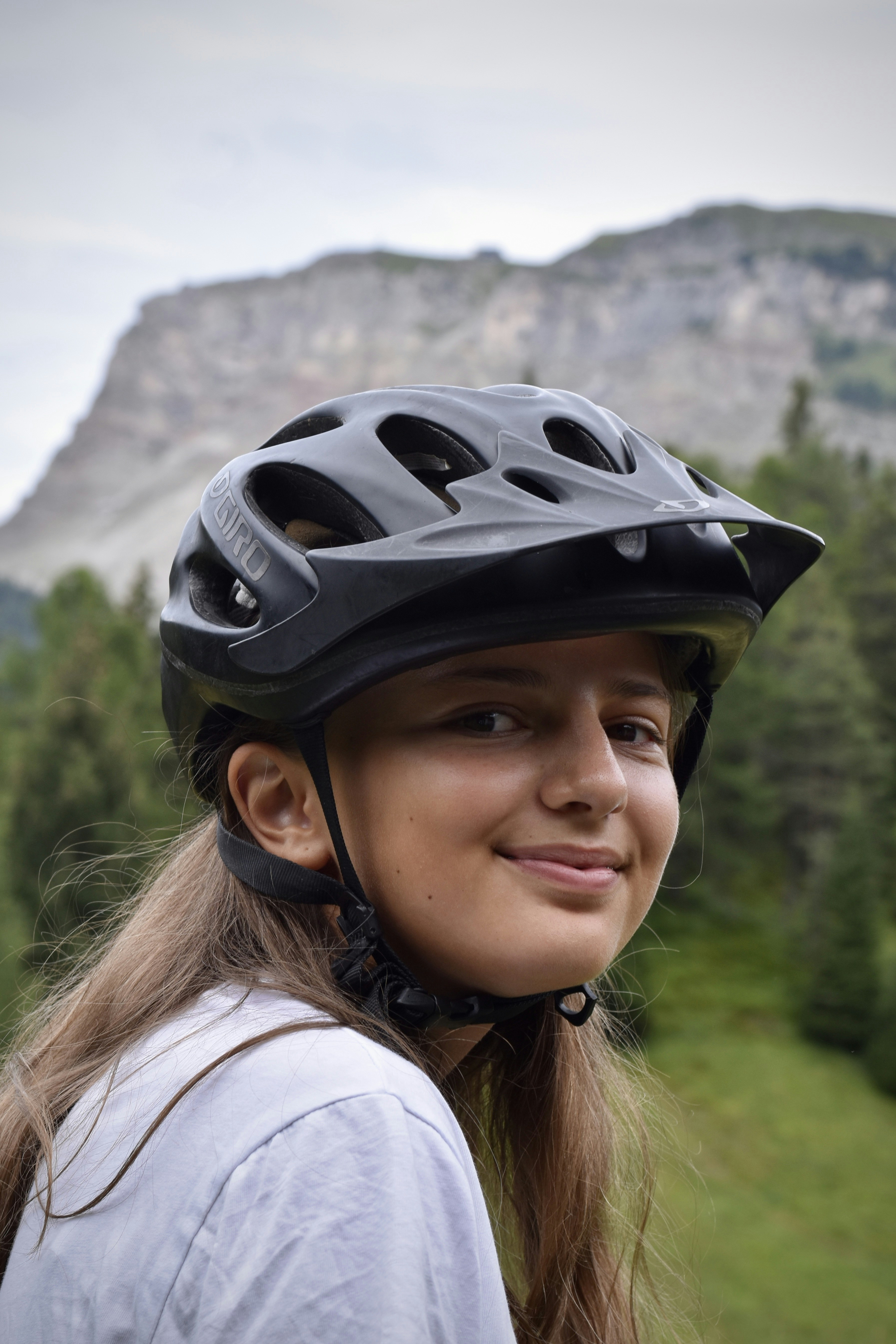 Helmeted Confidence: A Girl Cruiser Gains a Mountain Backdrop