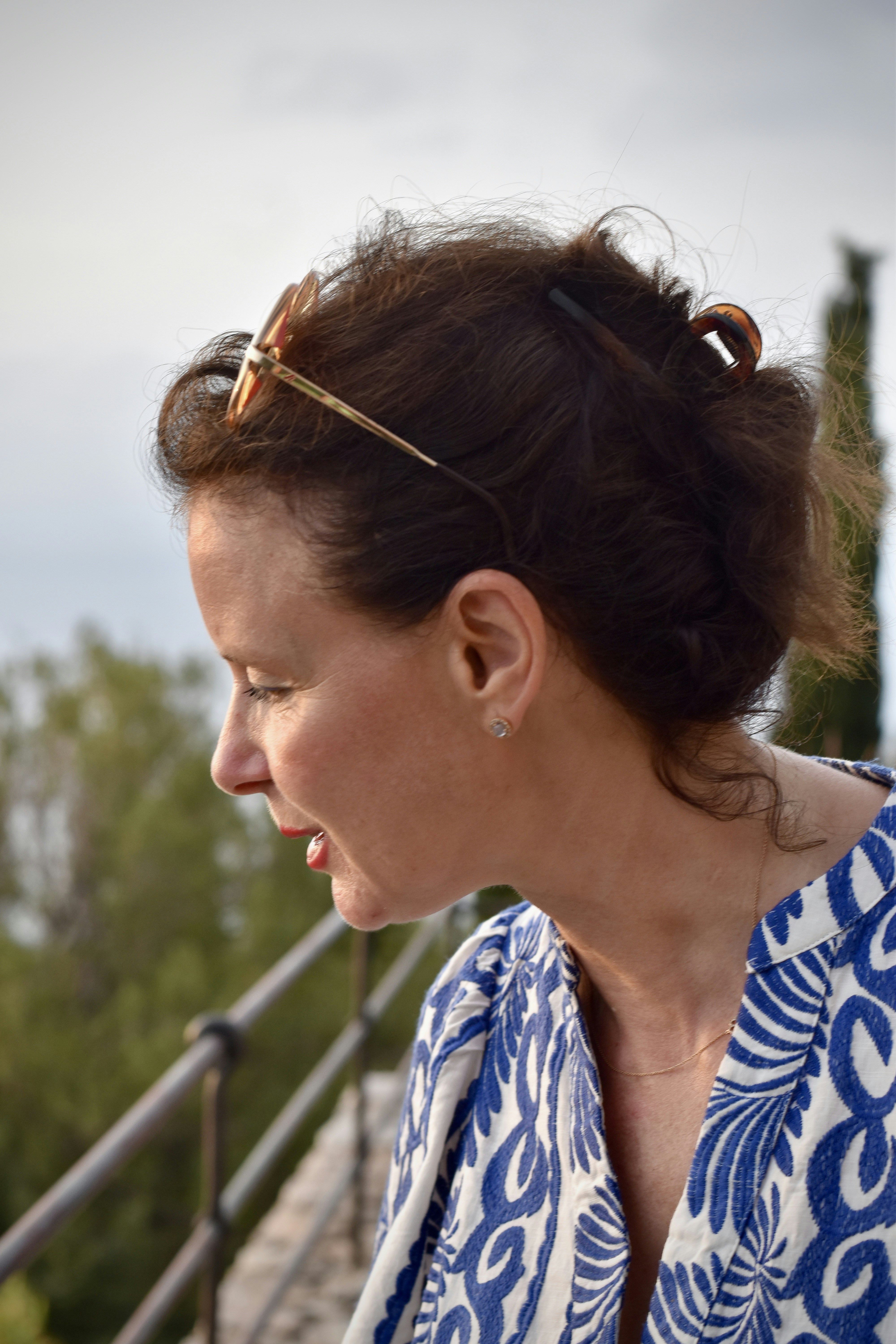 Portrait on the Balcony: A Close-Cropped Profile in Soft Dusk Light