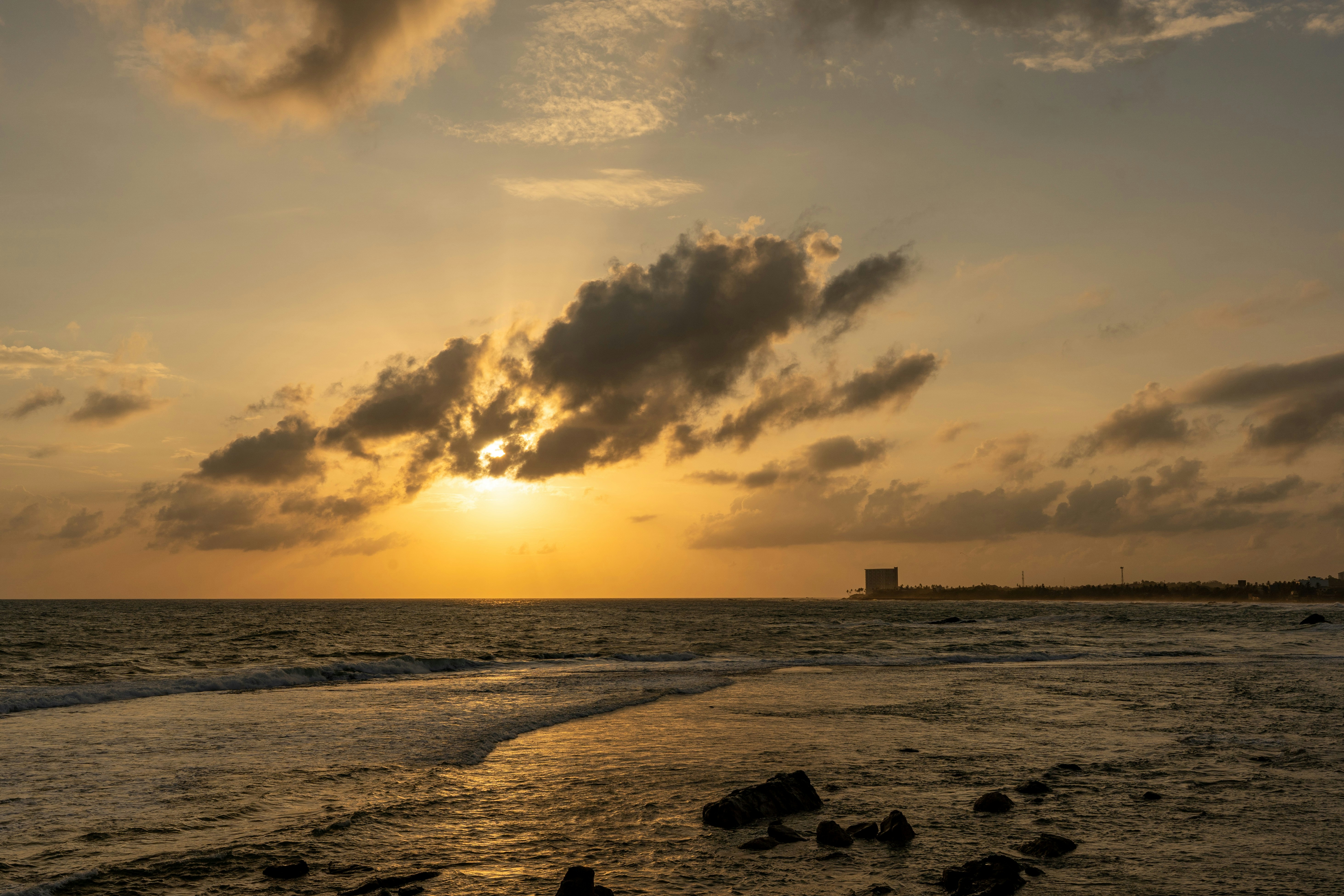 Golden Horizon at Distant Breakwater