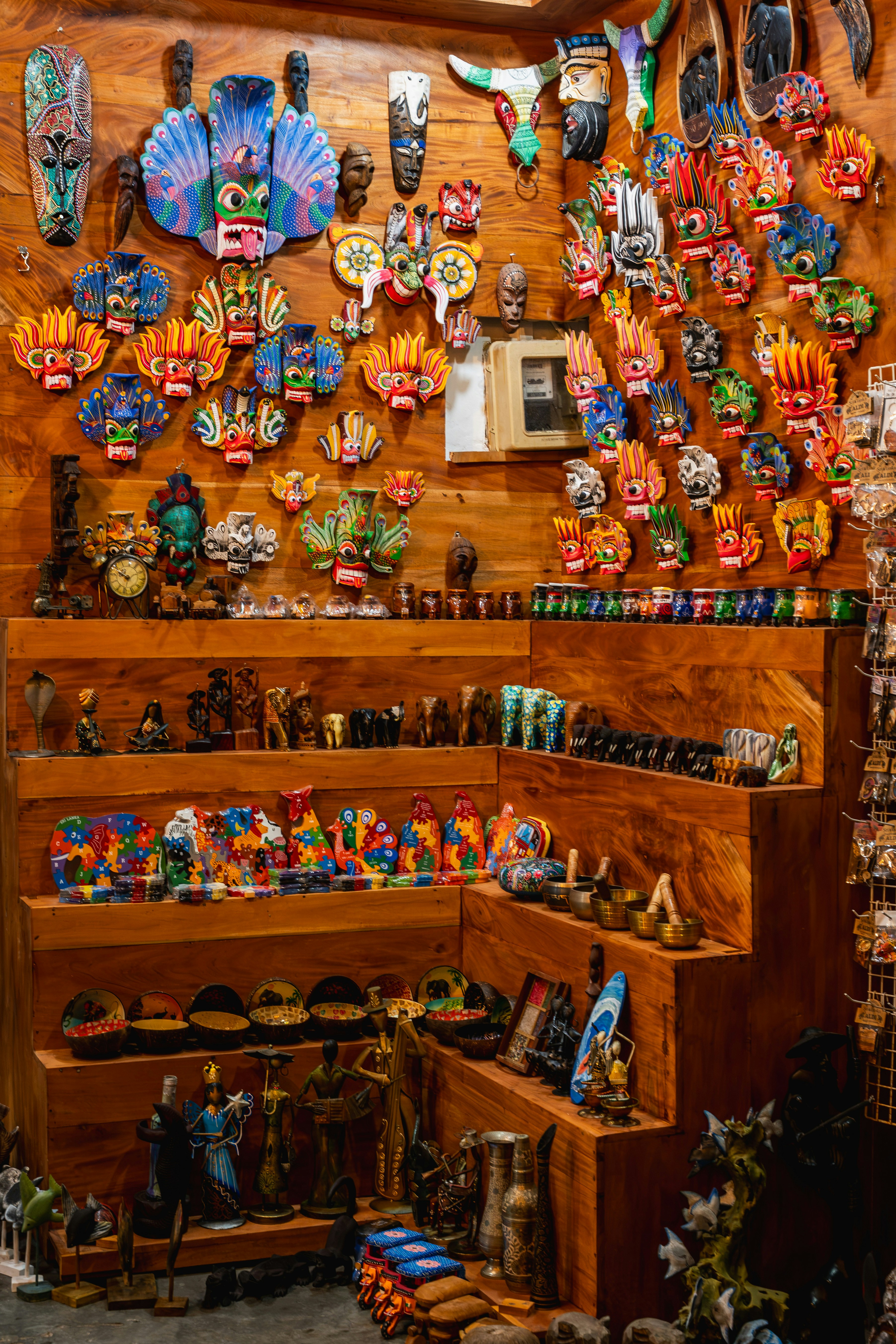 Vibrant Mask Wall: A Colorful Bazaar of Handcrafted Faces