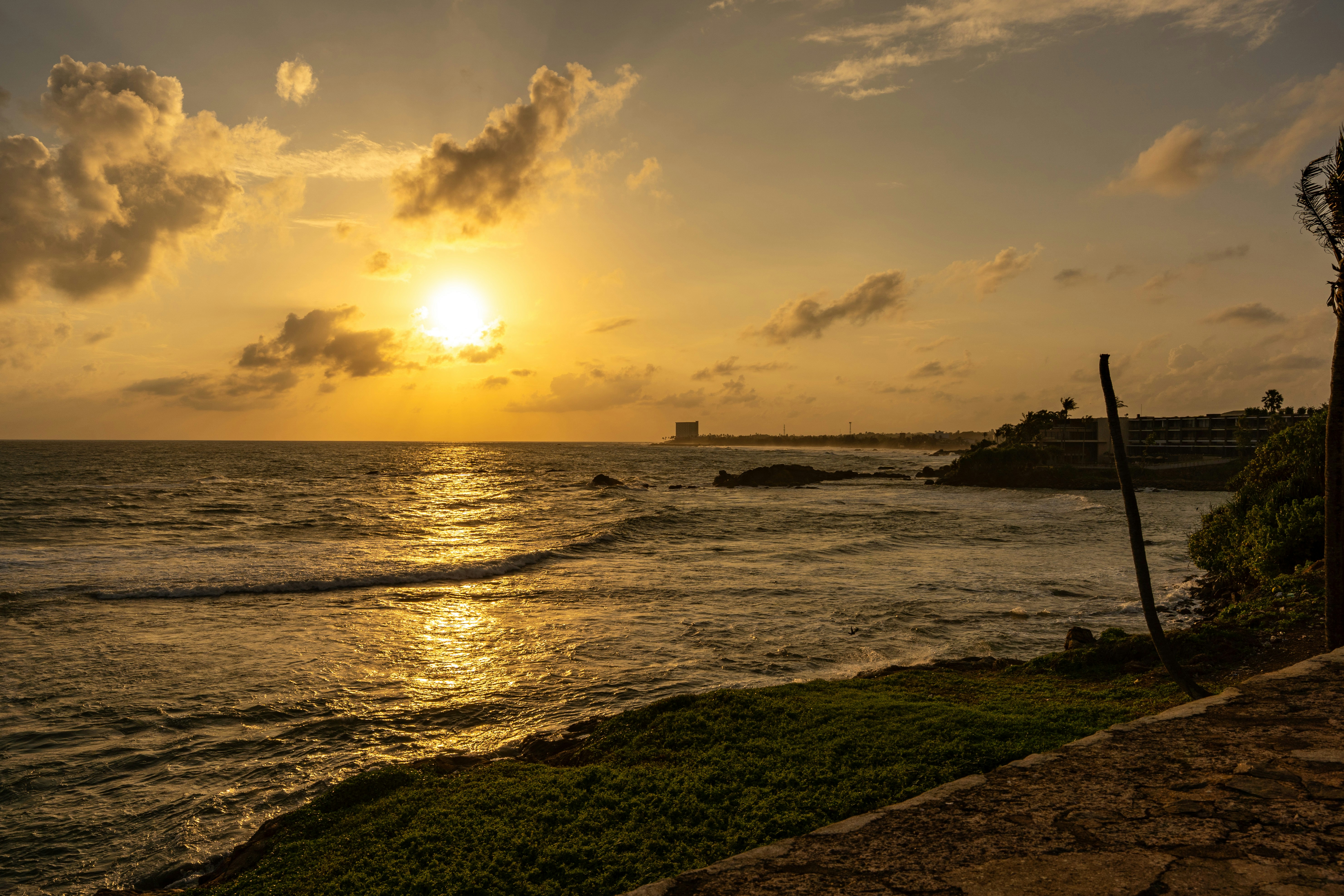 Golden Horizon: Sunset Over Calm Seas