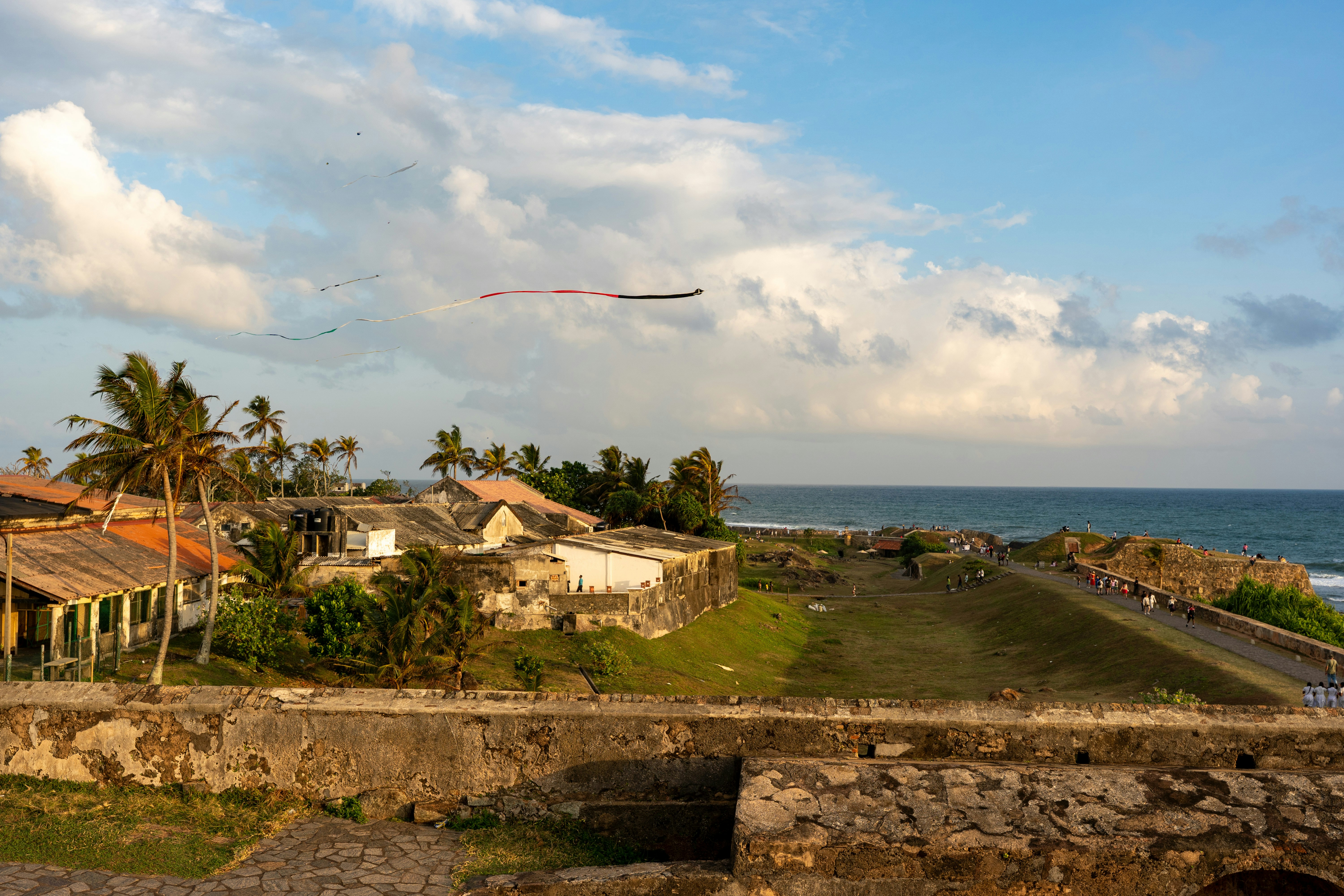 Coastal Fortress Under a Kite-Lined Sky