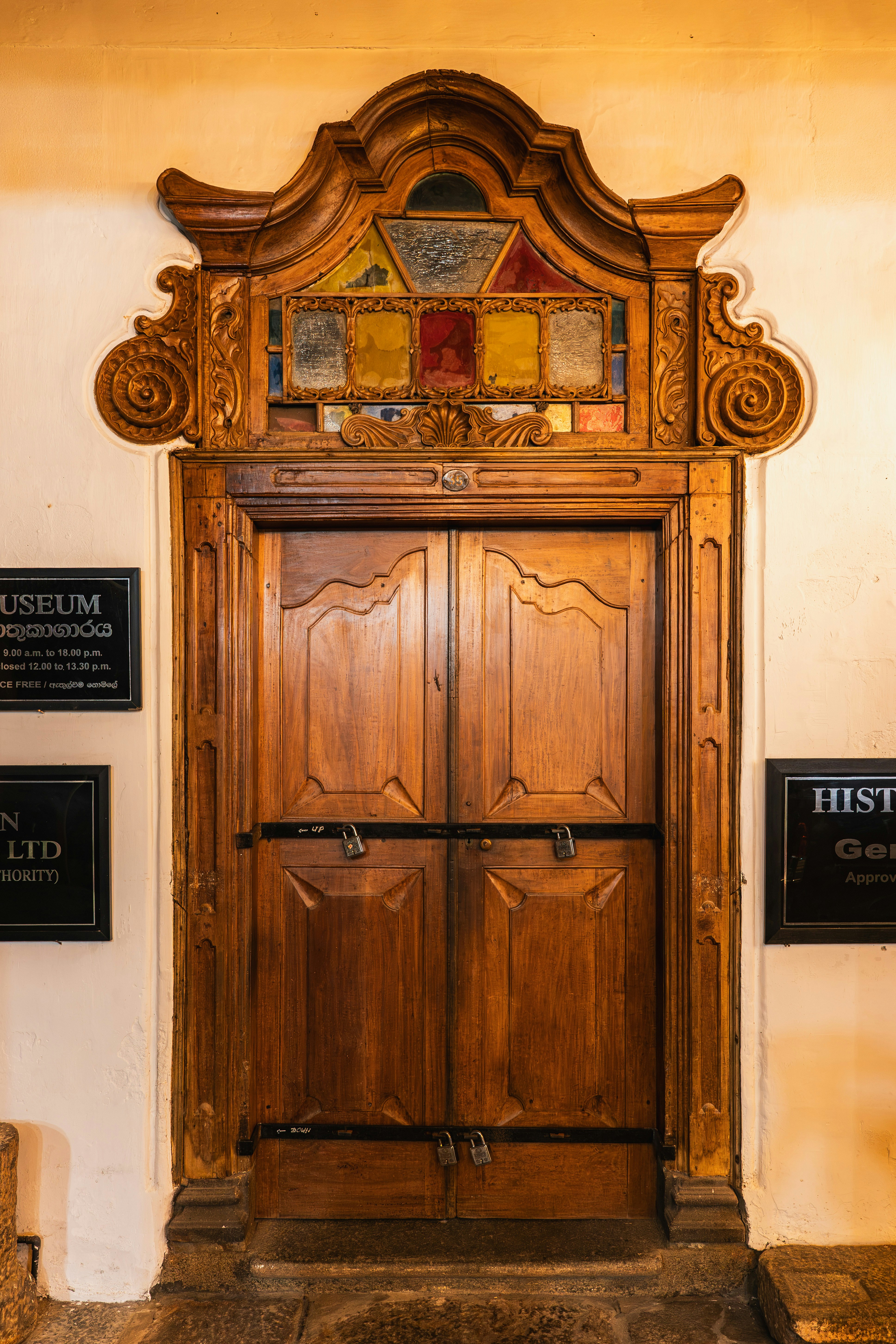 The Guarded Portal: A Rustic Door with Ornate Carving