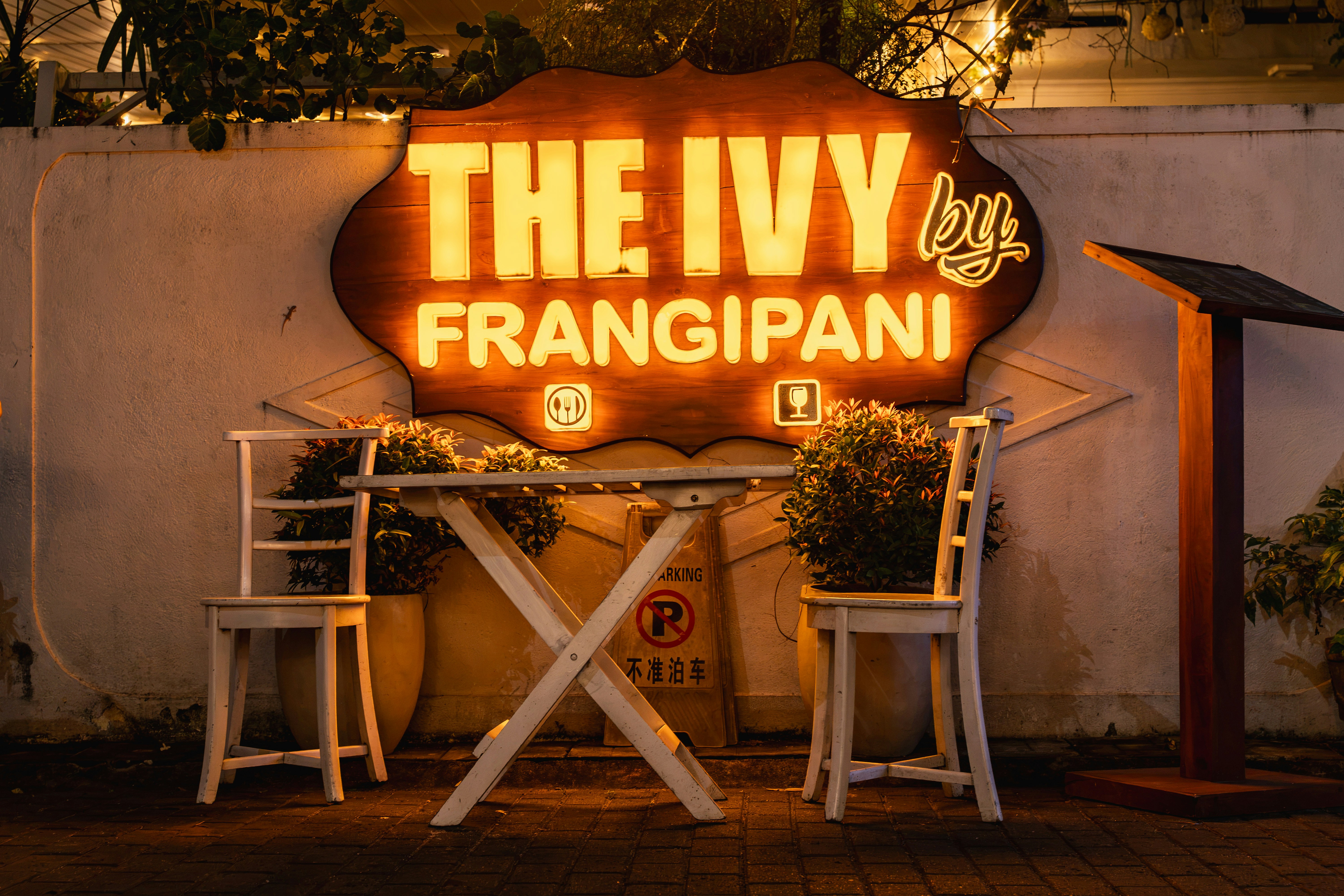 Neon Sign, Rustic Café Terrace Under Warm Glow