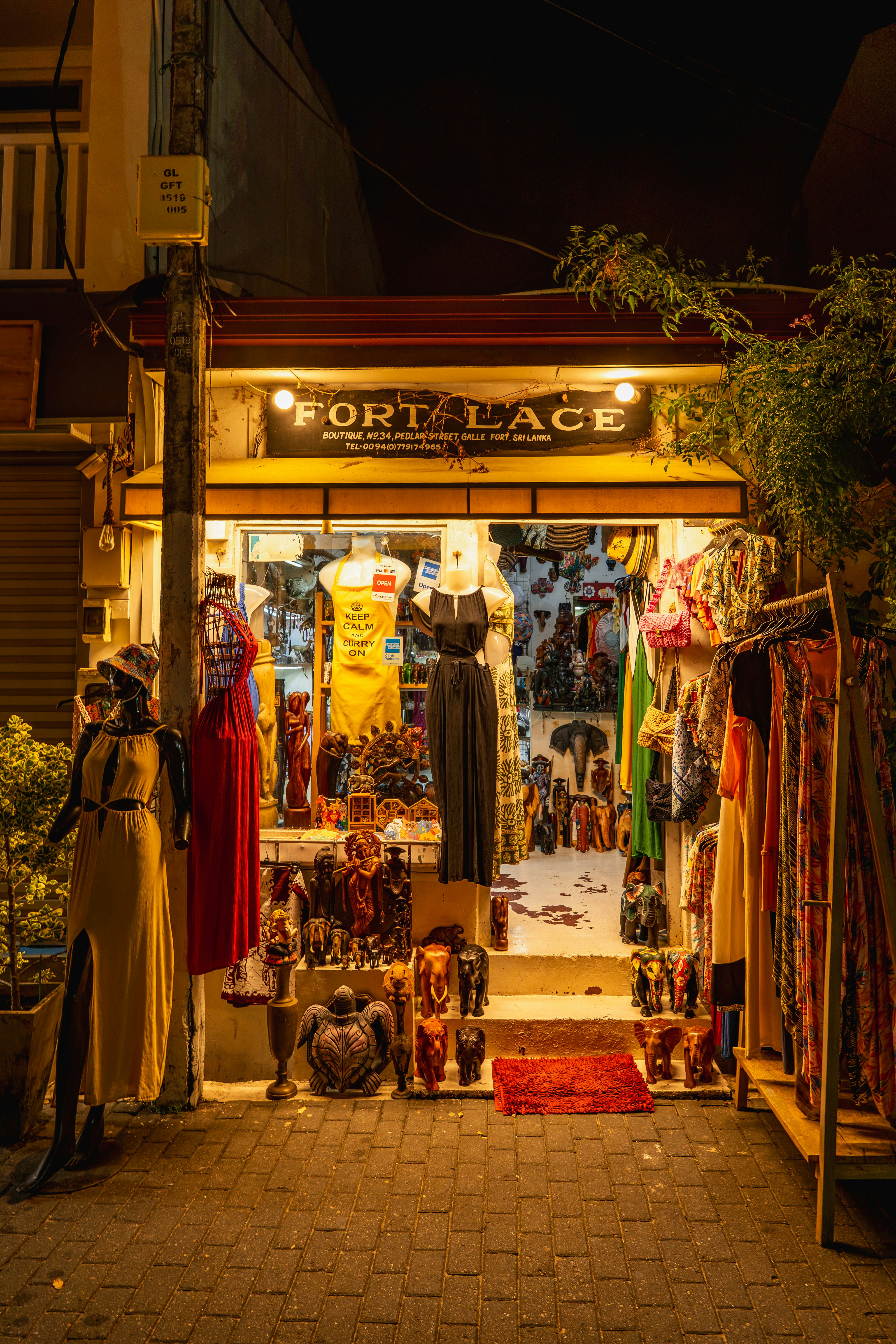 Neon Boutique at Night: A Window into a Bustling Street Shop