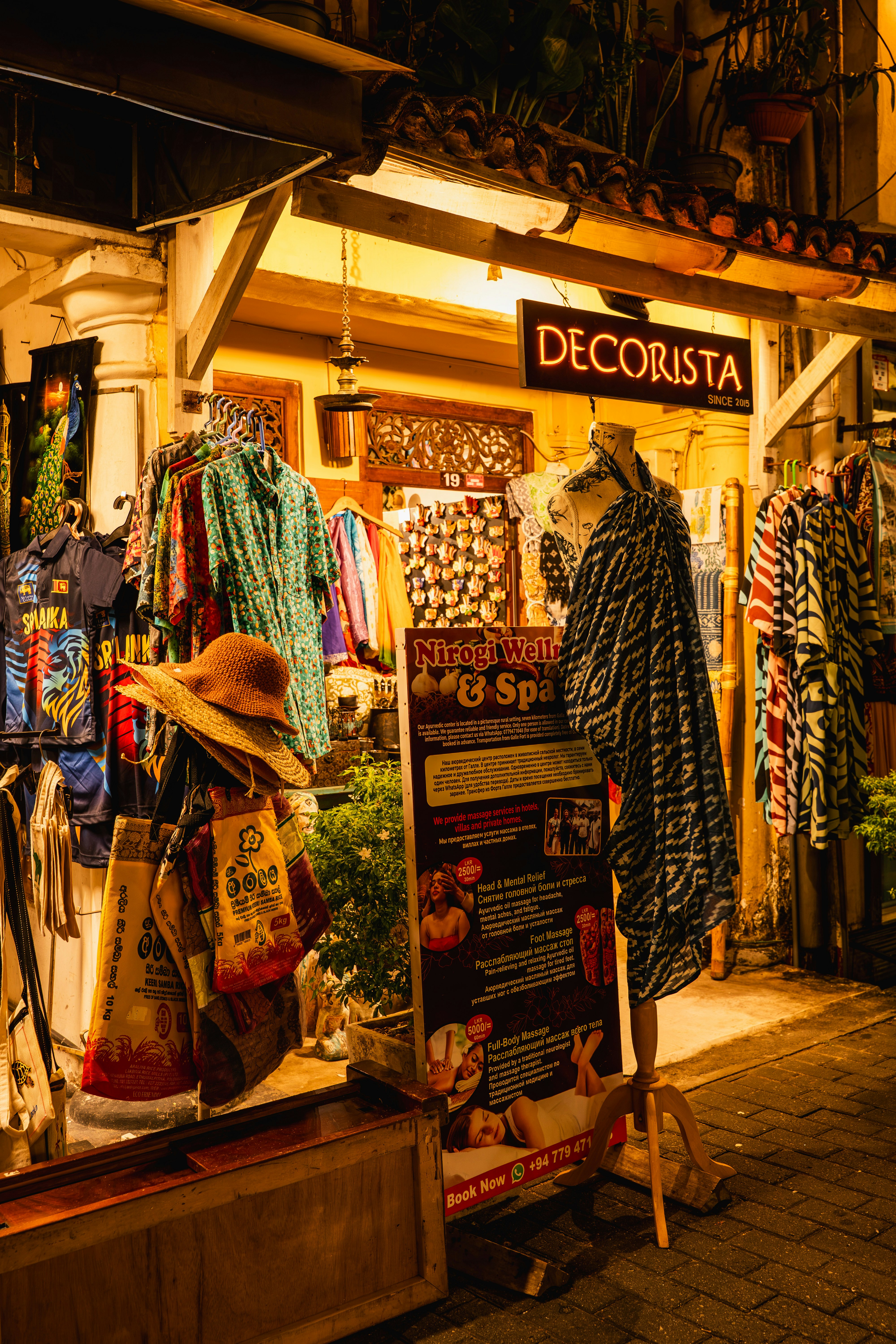 Warm Boutique Glow: A Night Market Dress Shop Bathed in Amber Light