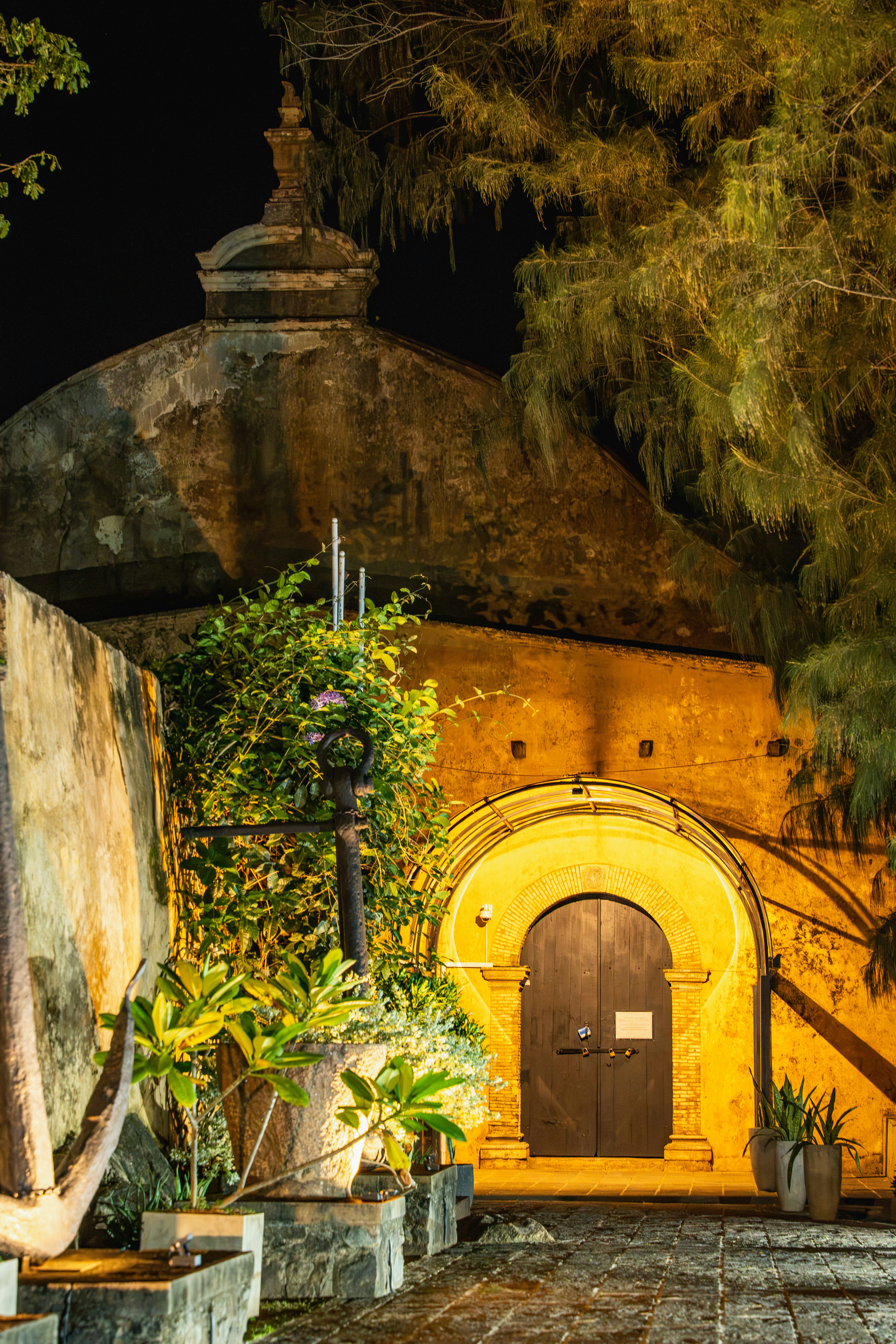 Moonlit Arch: A Warm Gateway to Quiet Gardens