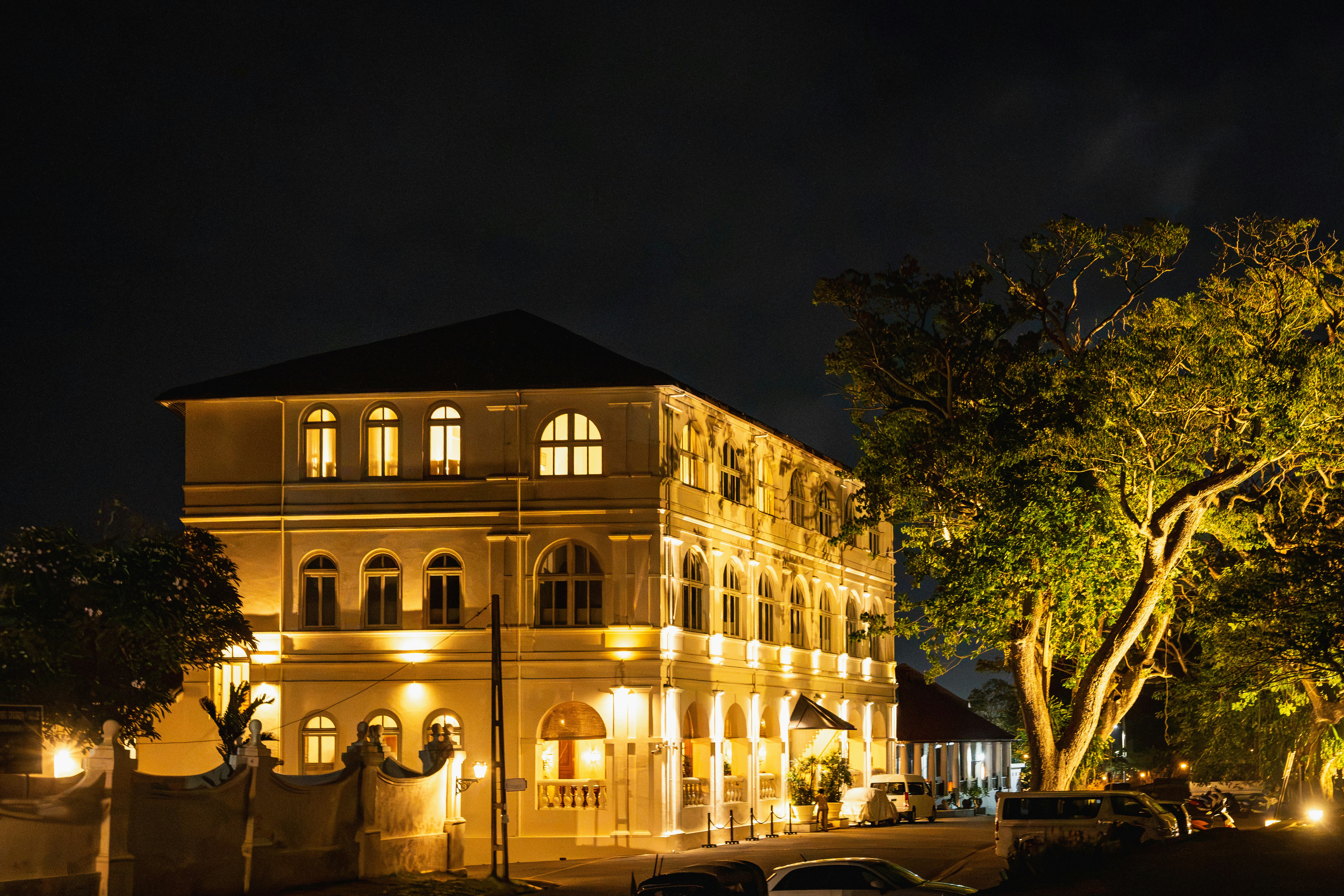 Luminous Colonial House against Nightfall