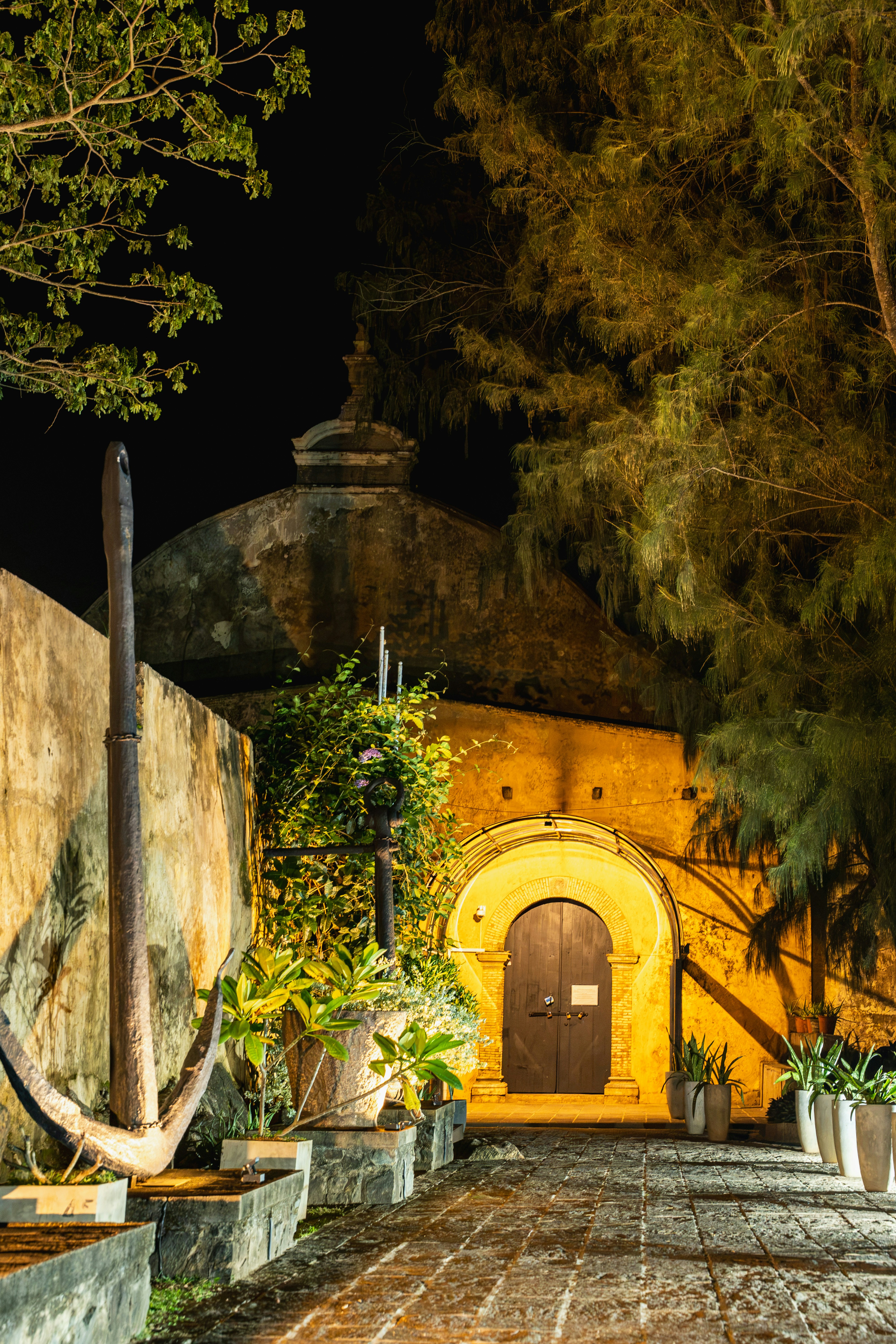 Moonlit Archway: A Quiet Courtyard at Night