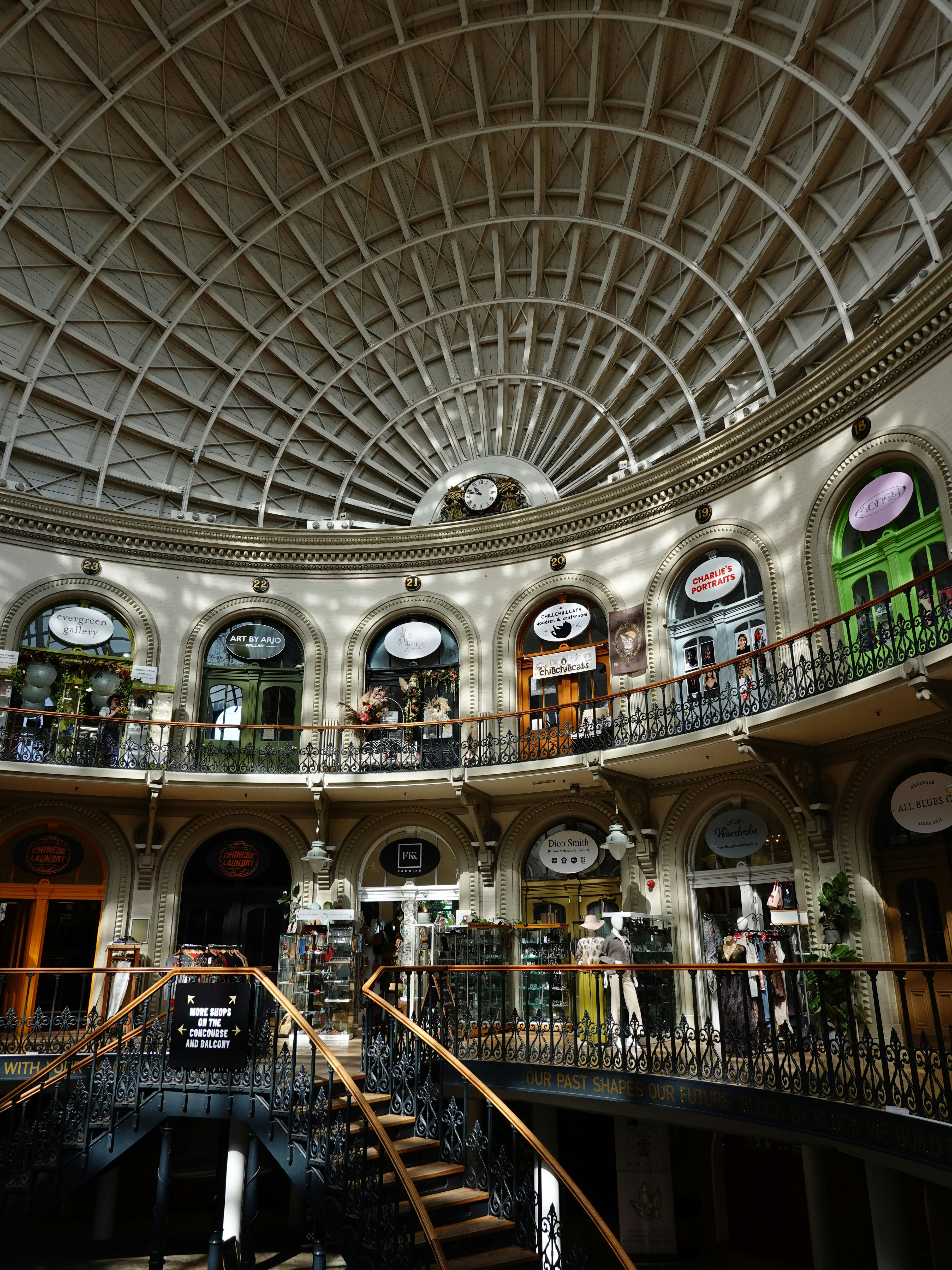 Ornate Glass Atrium Gallery under a Sunlit Dome