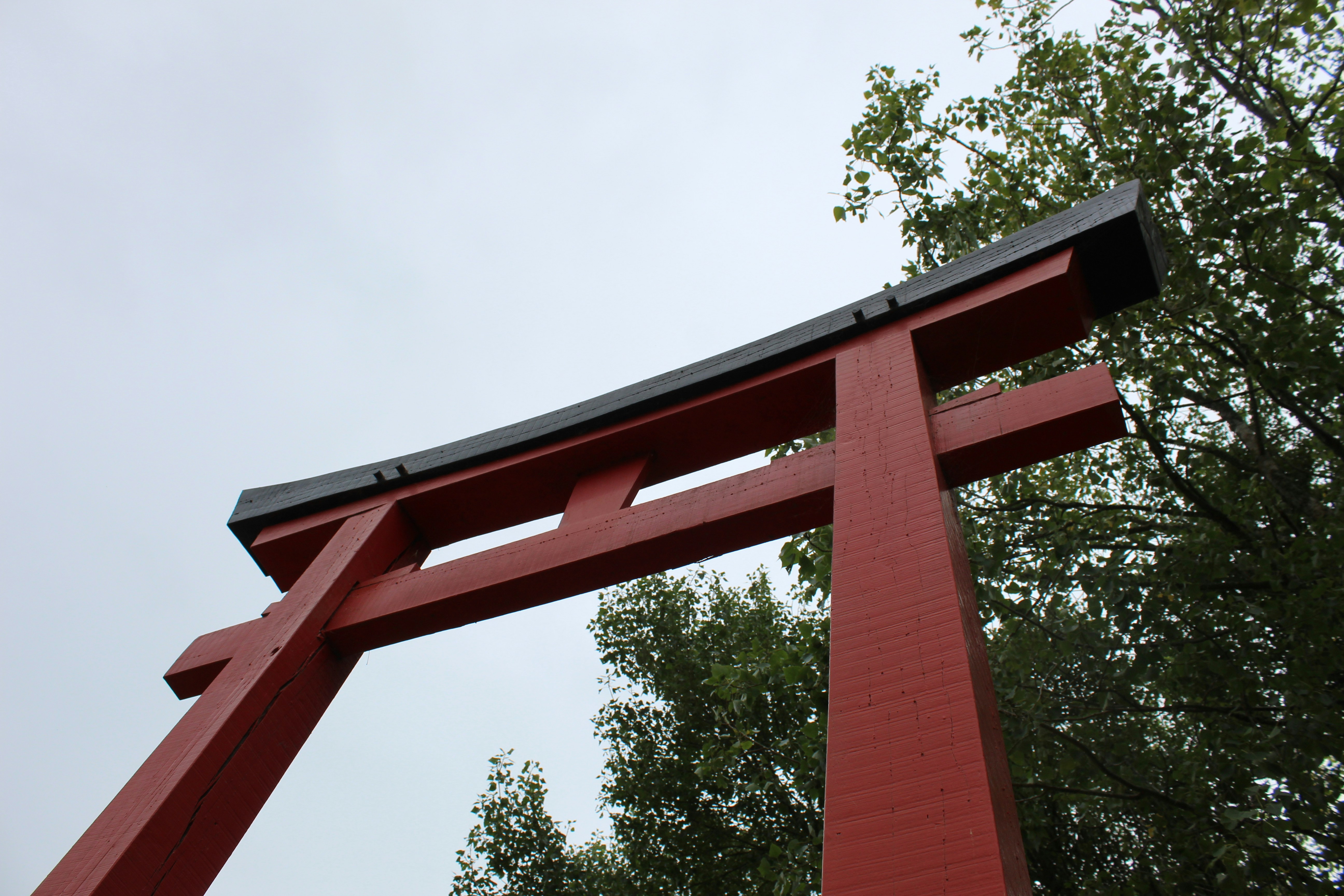 Red Gate Framing a Skyward Moment